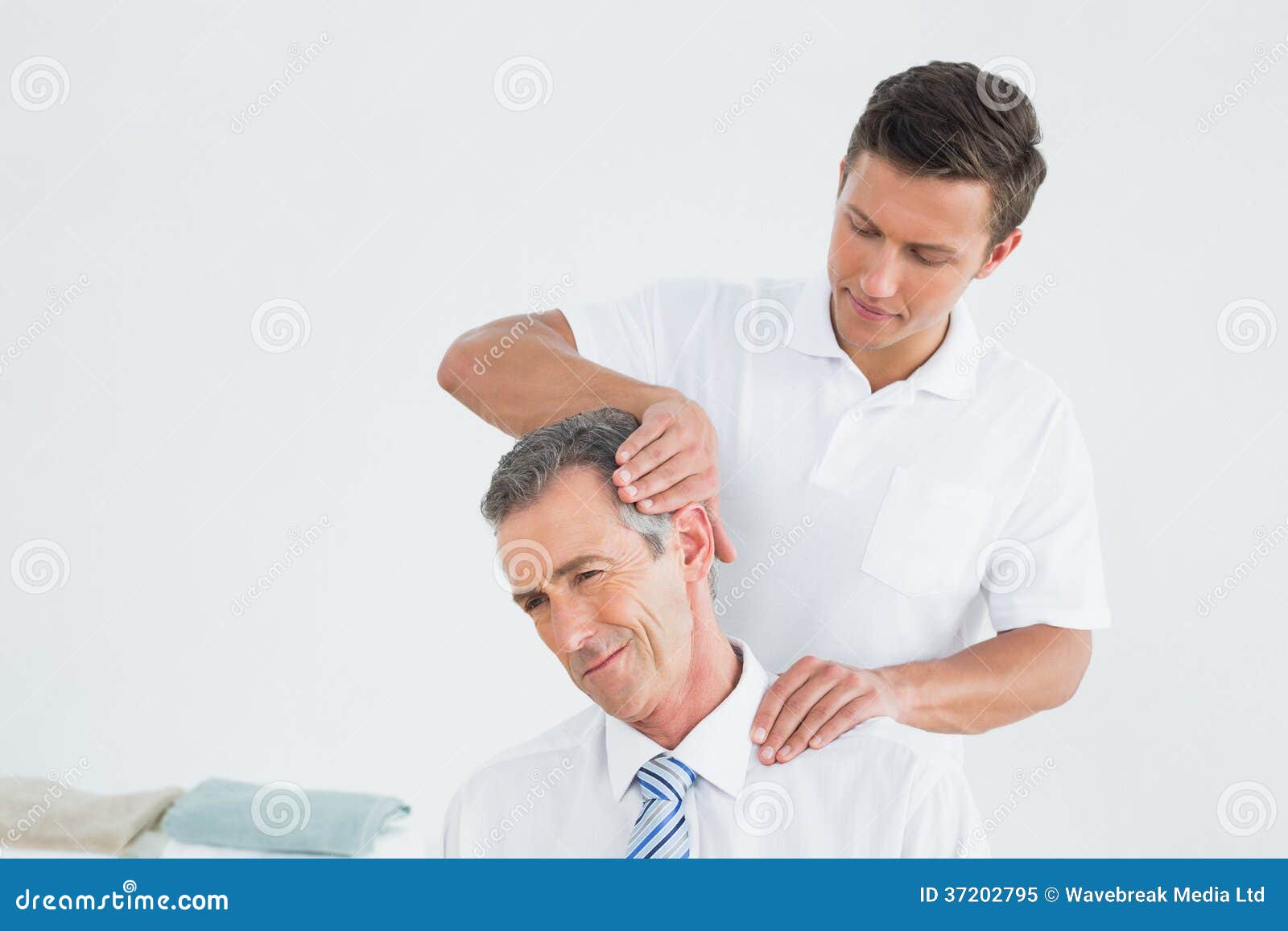 Male Chiropractor Doing Neck Adjustment Stock Image - Image of cure ...