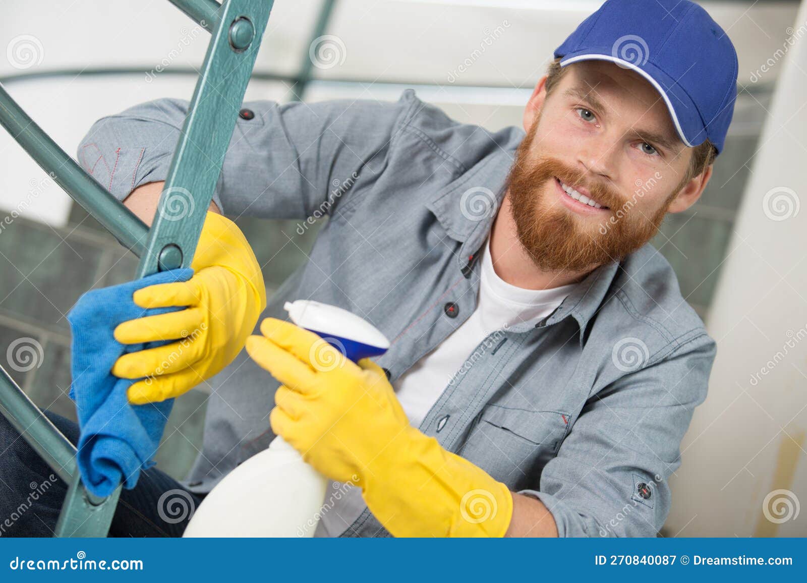 Male Cleaning Spraying while Smiling at Camera Stock Image - Image of ...