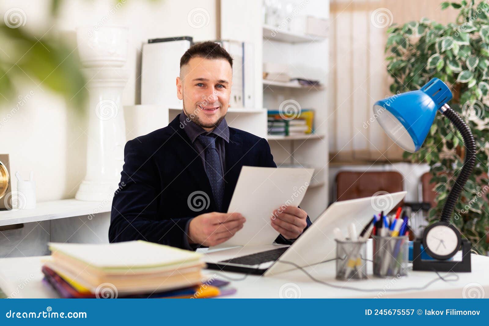 Male Clerical Worker Sitting at Table in Office Stock Image - Image of ...