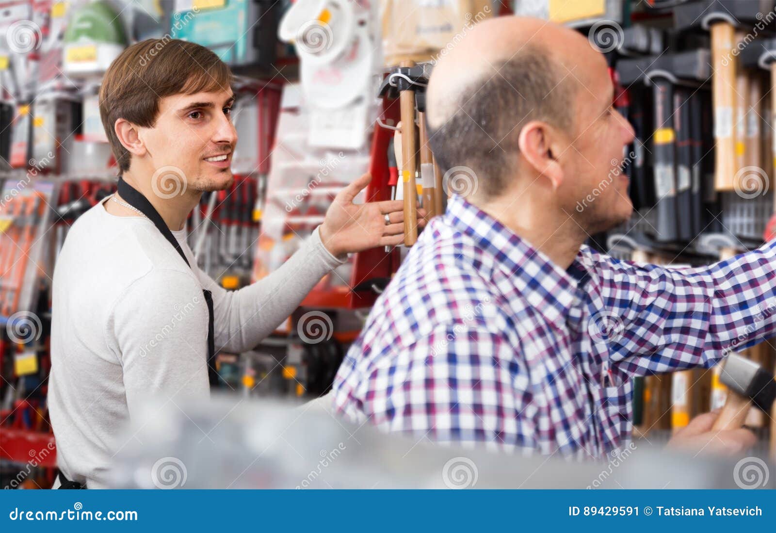 Male Client and Young Salesman at Tooling Section Stock Image - Image ...