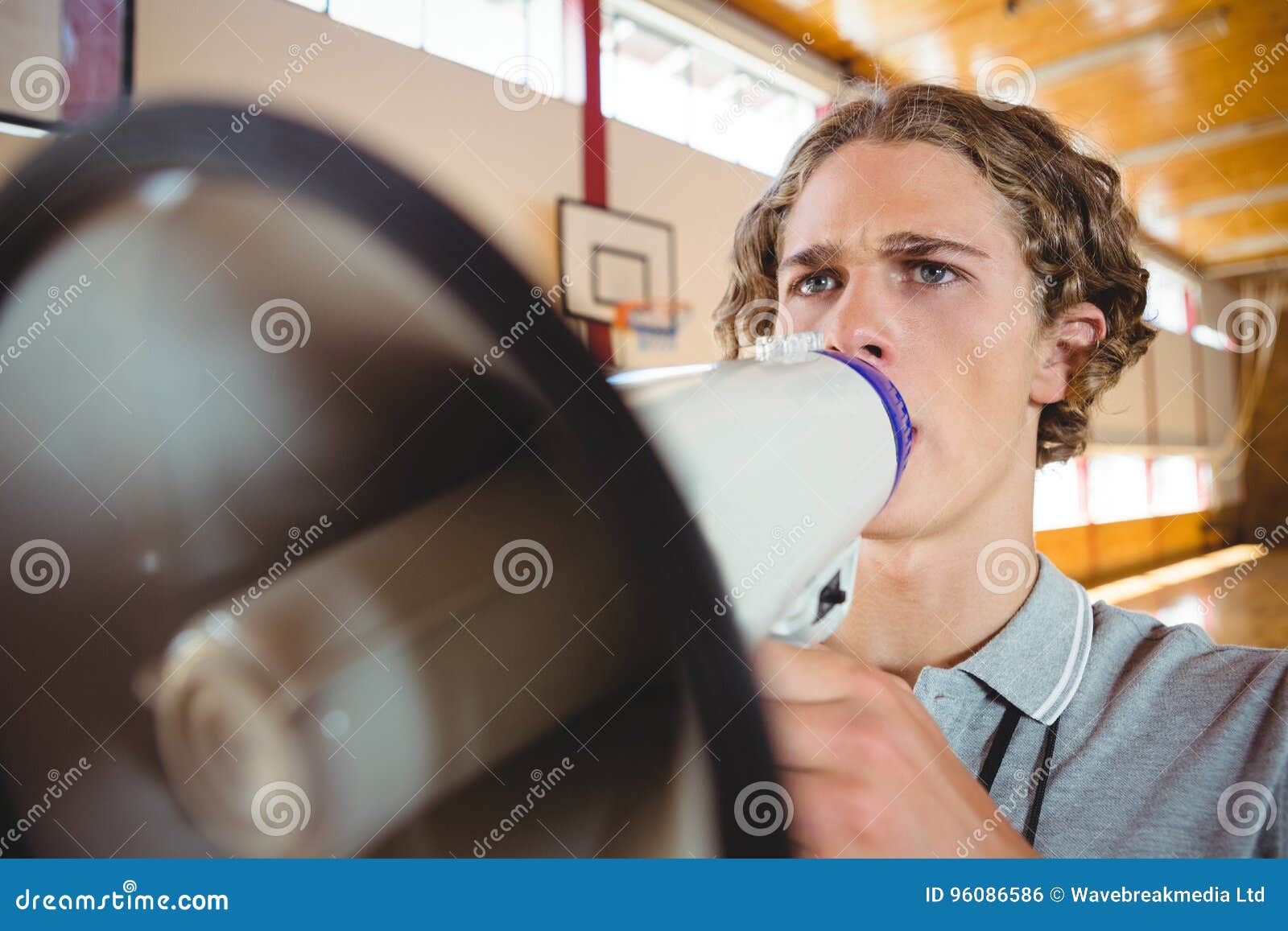 Male coach using megaphone stock photo. Image of clothing - 96086586