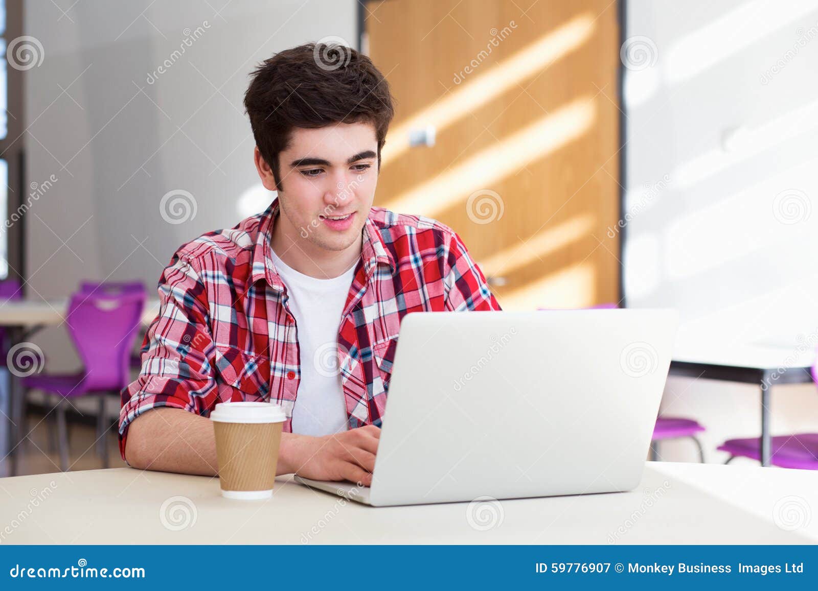 Male College Student Using Laptop in Classroom Stock Image - Image of ...