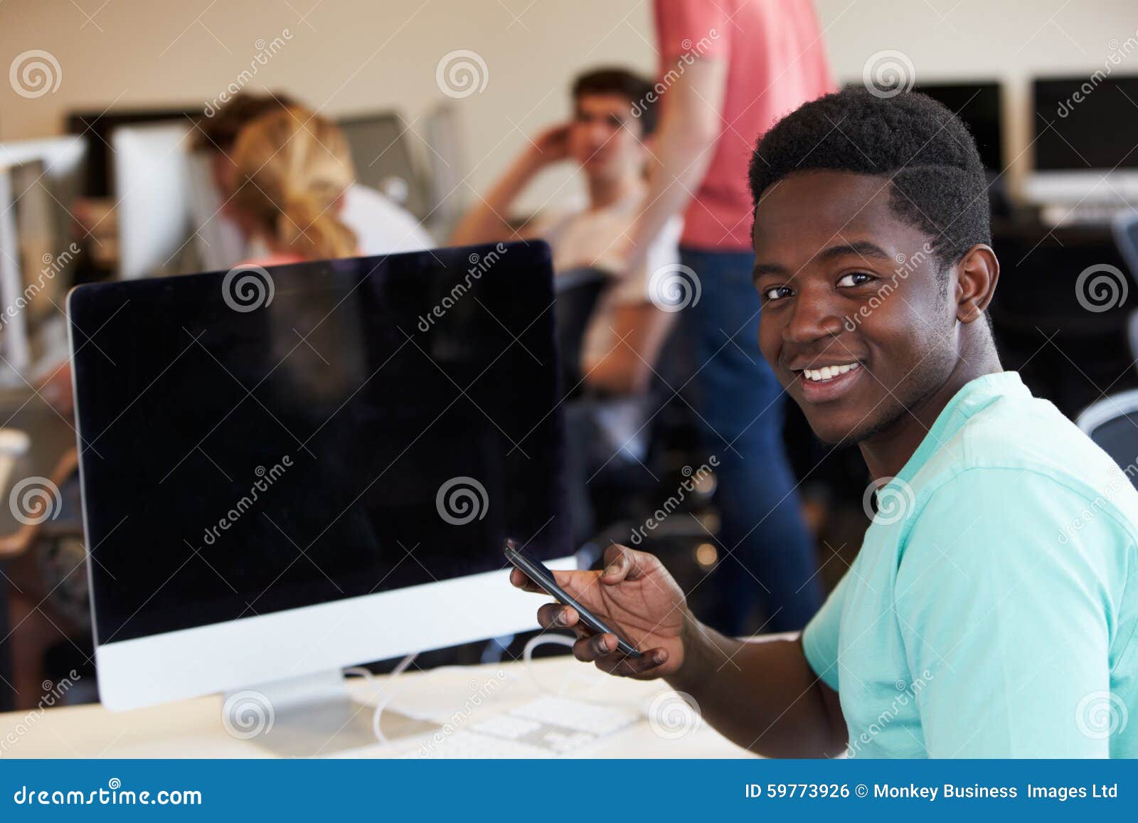 Male College Student Using Mobile Phone in Classroom Stock Photo ...