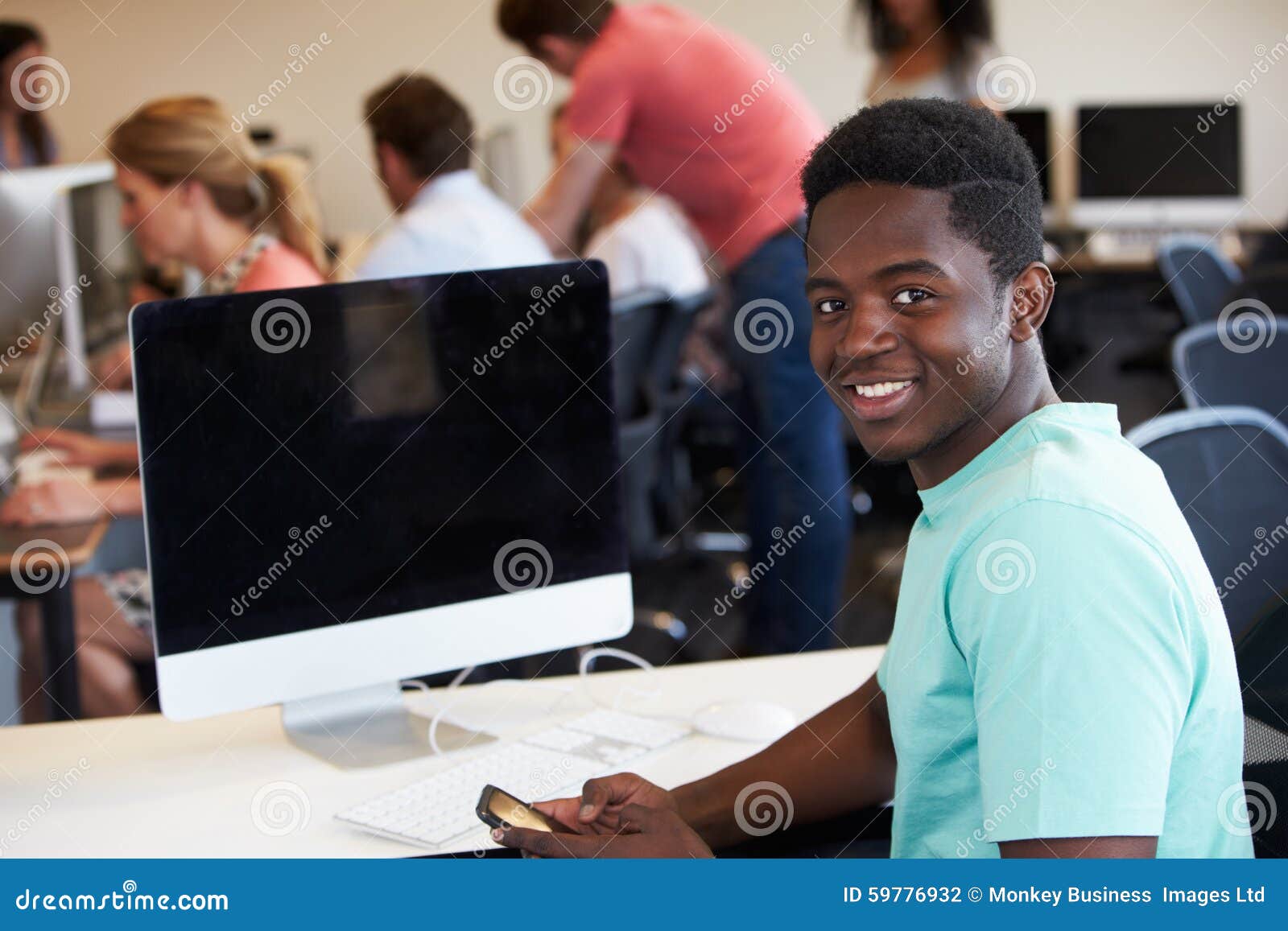 Male College Student Using Mobile Phone in Classroom Stock Photo ...