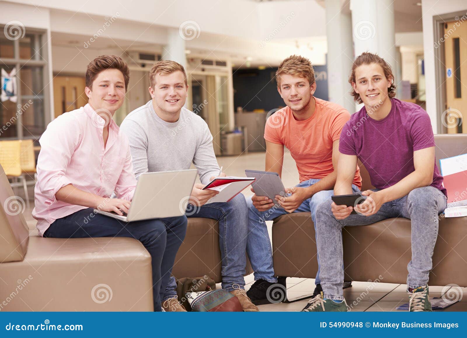 Male College Students Sitting and Talking Together Stock Photo - Image ...