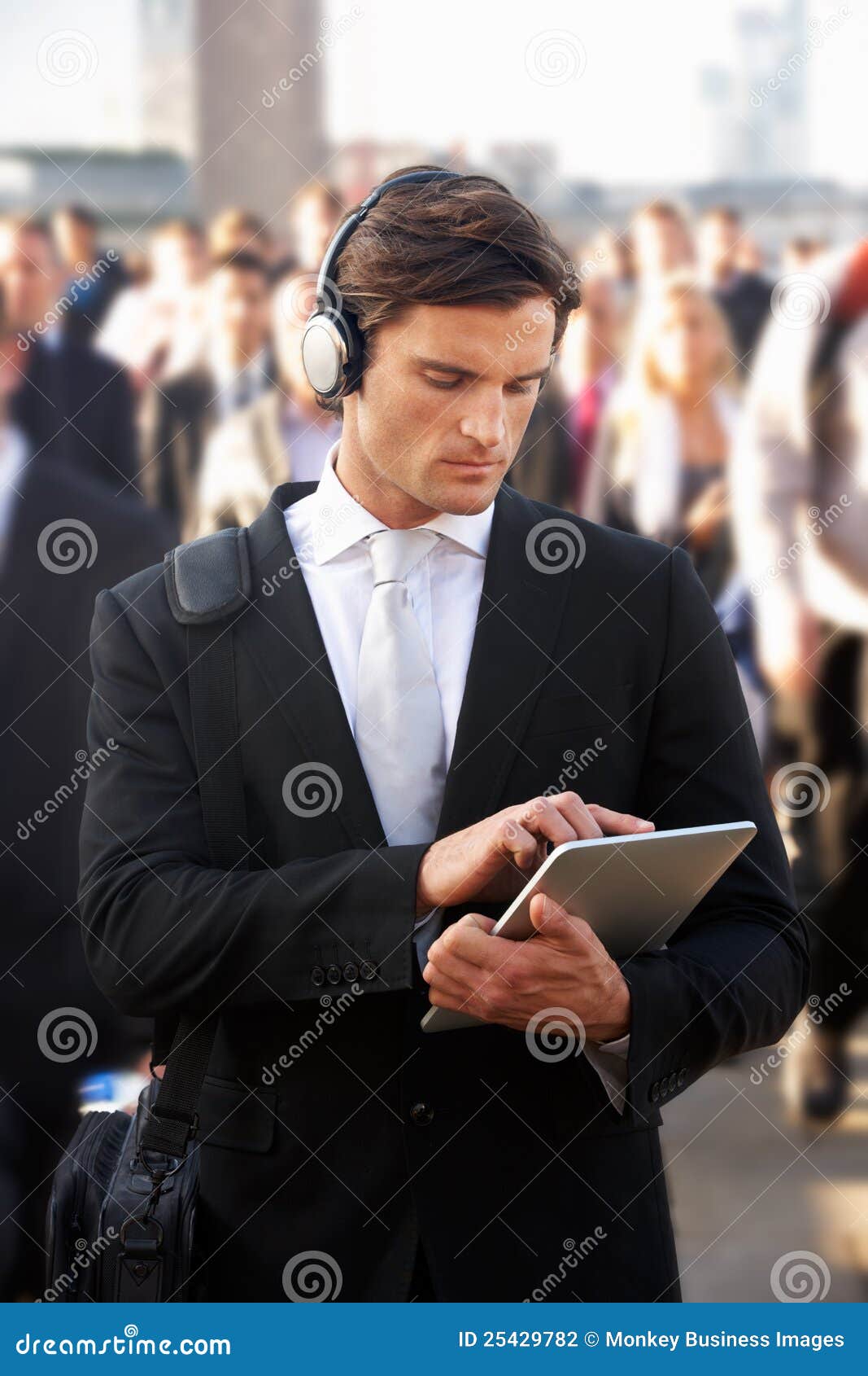 Male commuter in crowd stock photo. Image of smart, headphones - 25429782
