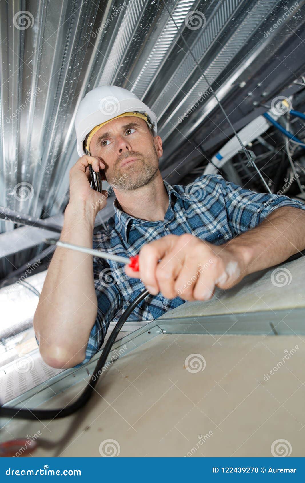 Male Construction Worker Builder on Cell Phone in Building Ceiling ...