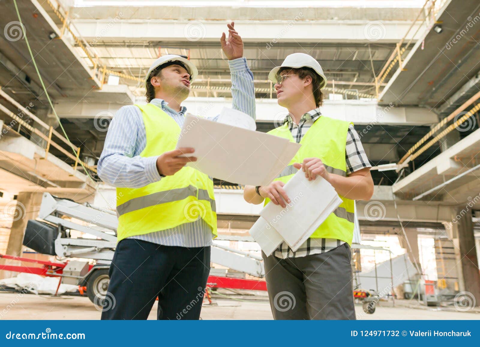 Male Construction Worker and Engineer at the Construction Site ...
