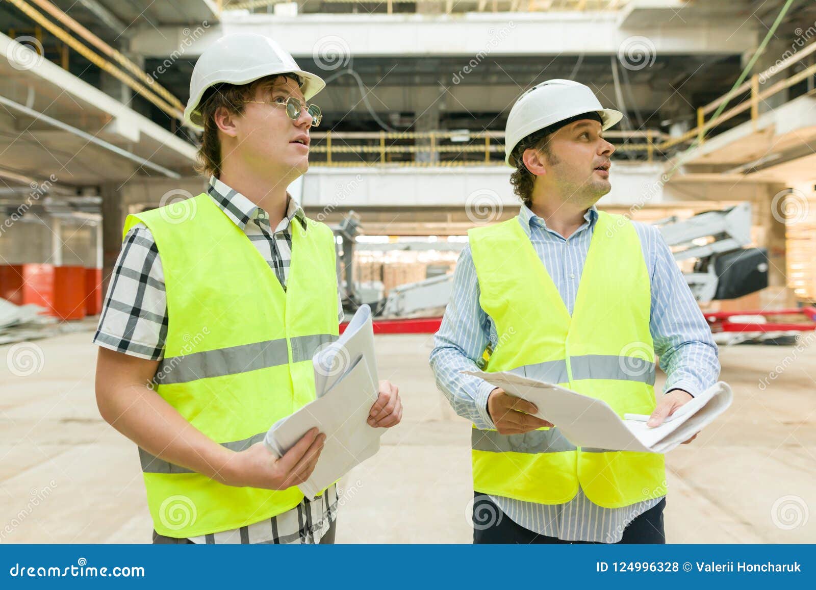 Male Construction Worker and Engineer at the Construction Site ...