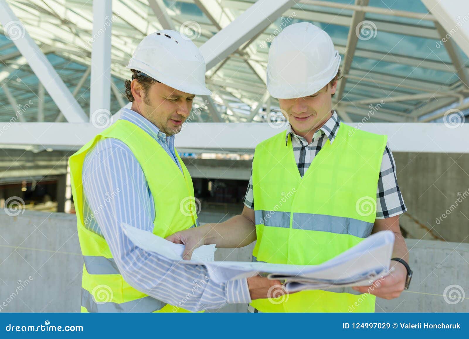Male Construction Worker and Engineer at the Construction Site ...