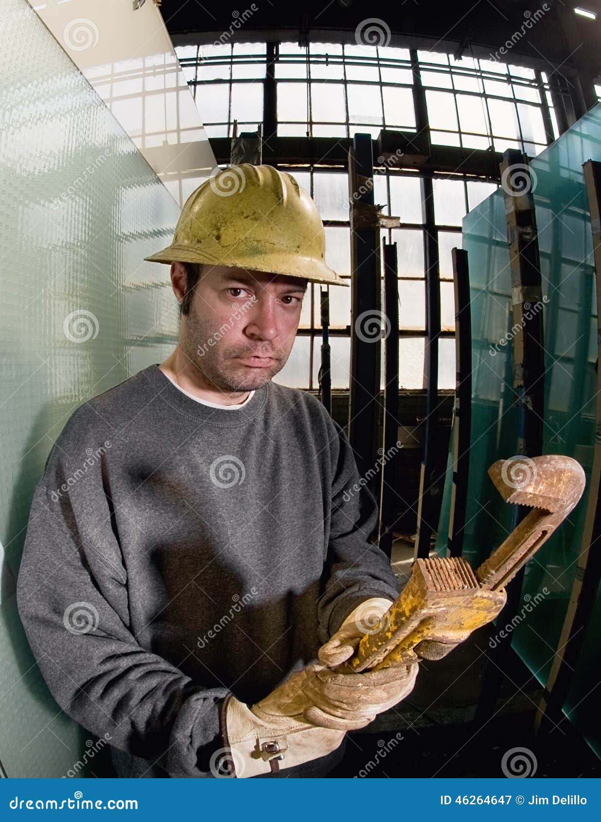 Male Construction Worker with Large Pipe Wrench Stock Image - Image of ...