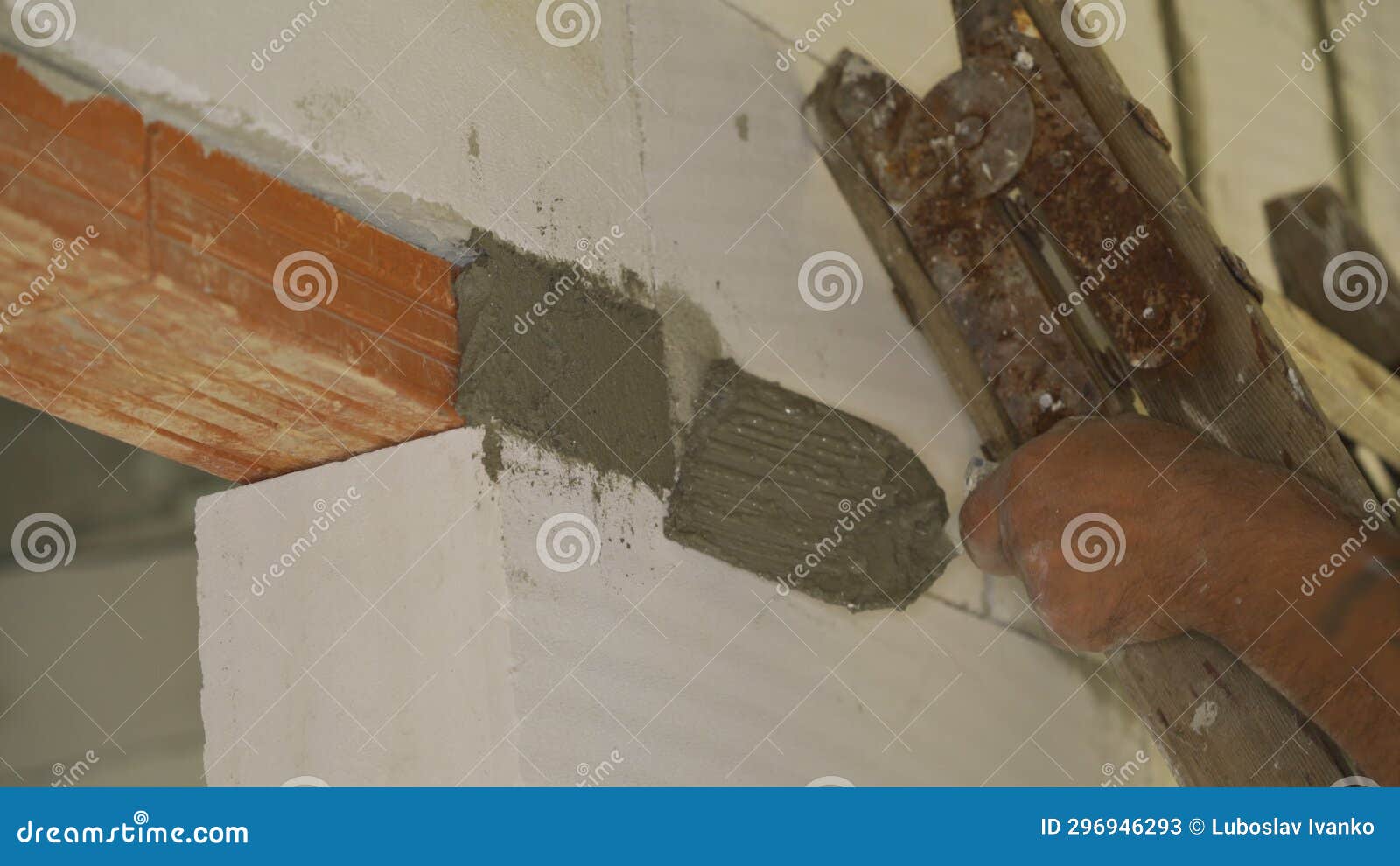 Male Construction Worker Securing Bricks at Door Frame Top Installed in ...