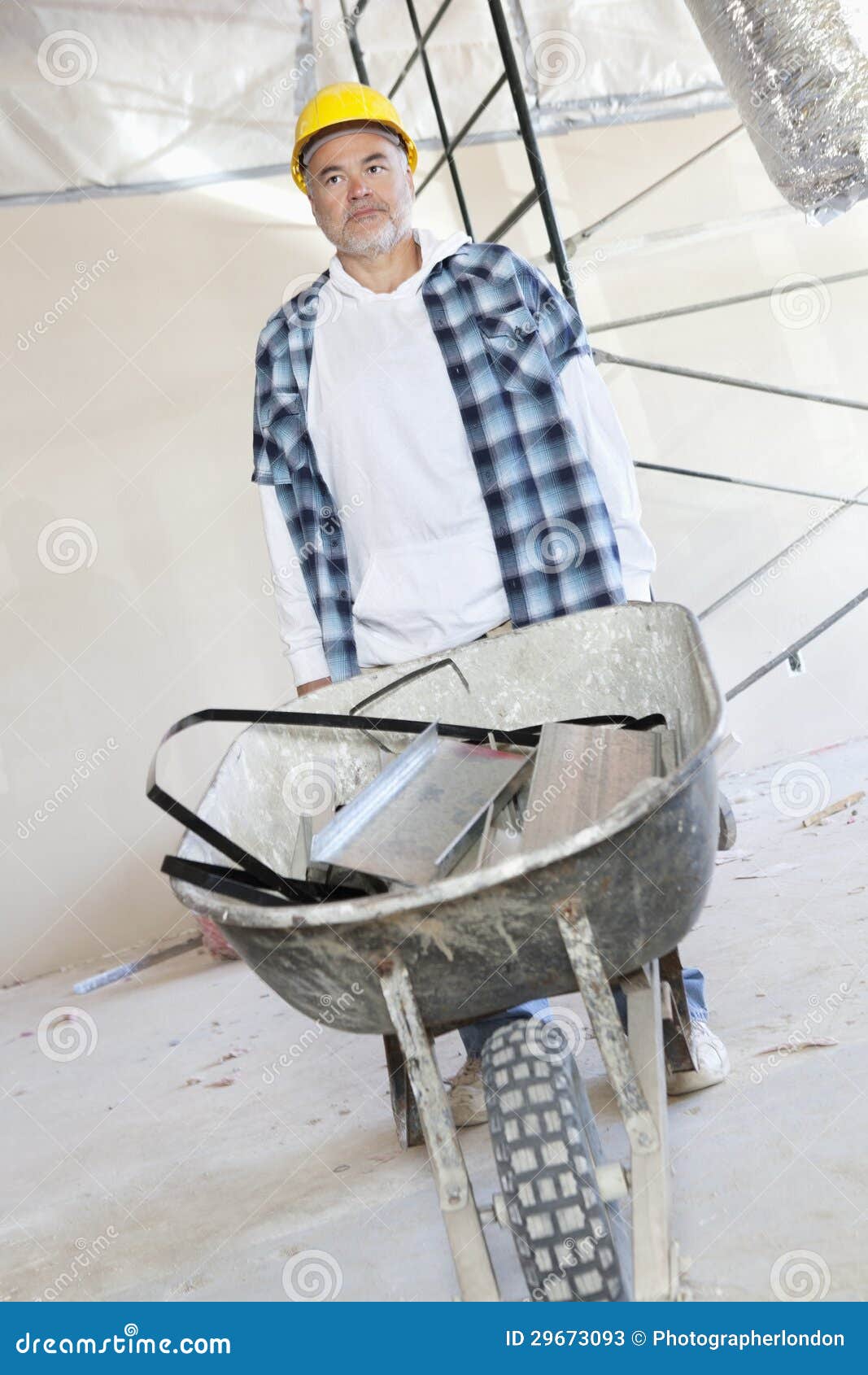 Male Construction Worker Standing with a Wheelbarrow Stock Image ...