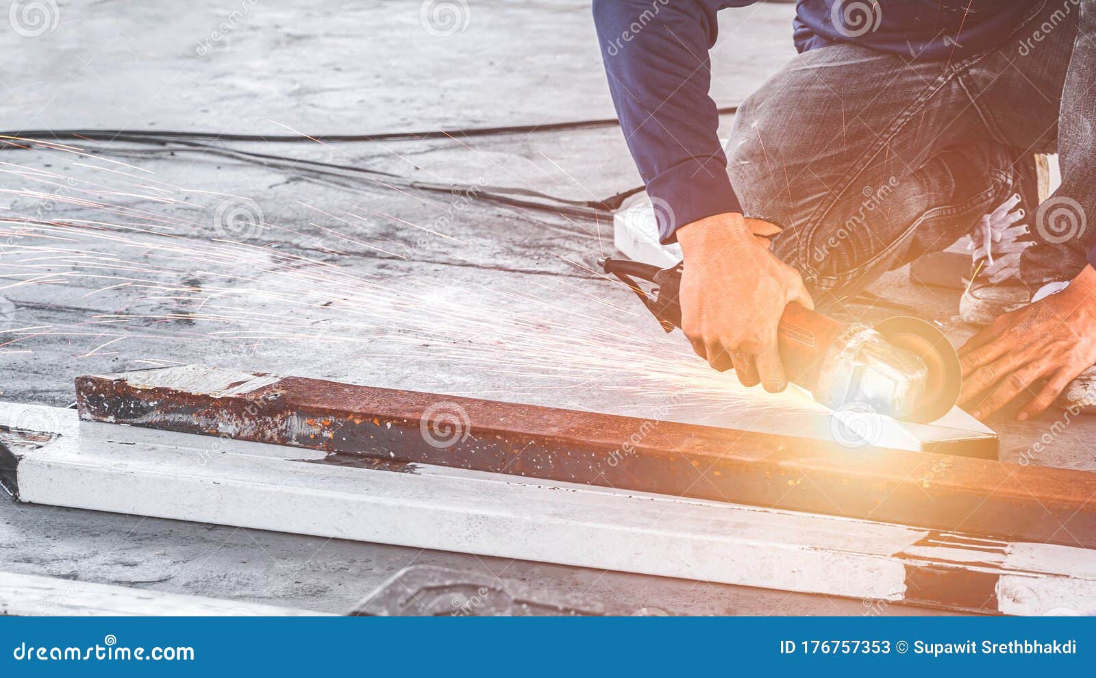 Male Construction Worker Using Electrical Angle Grinder for Cutting ...