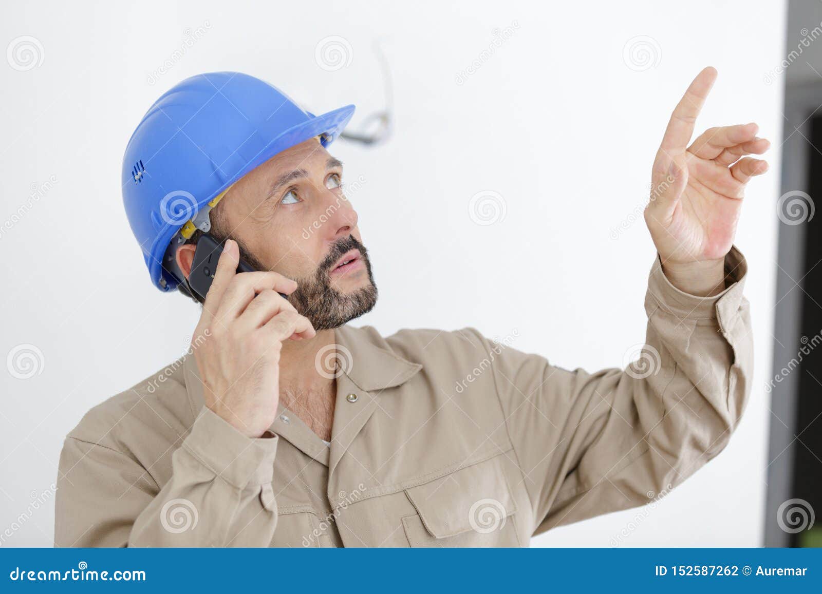 Male Construction Worker Using Mobile Phone Stock Photo - Image of ...