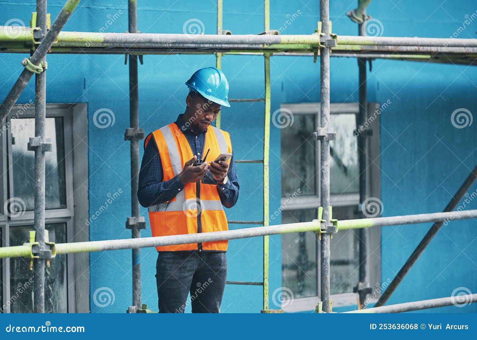 Male Construction Worker Working Checking a Digital Building Plan on a ...