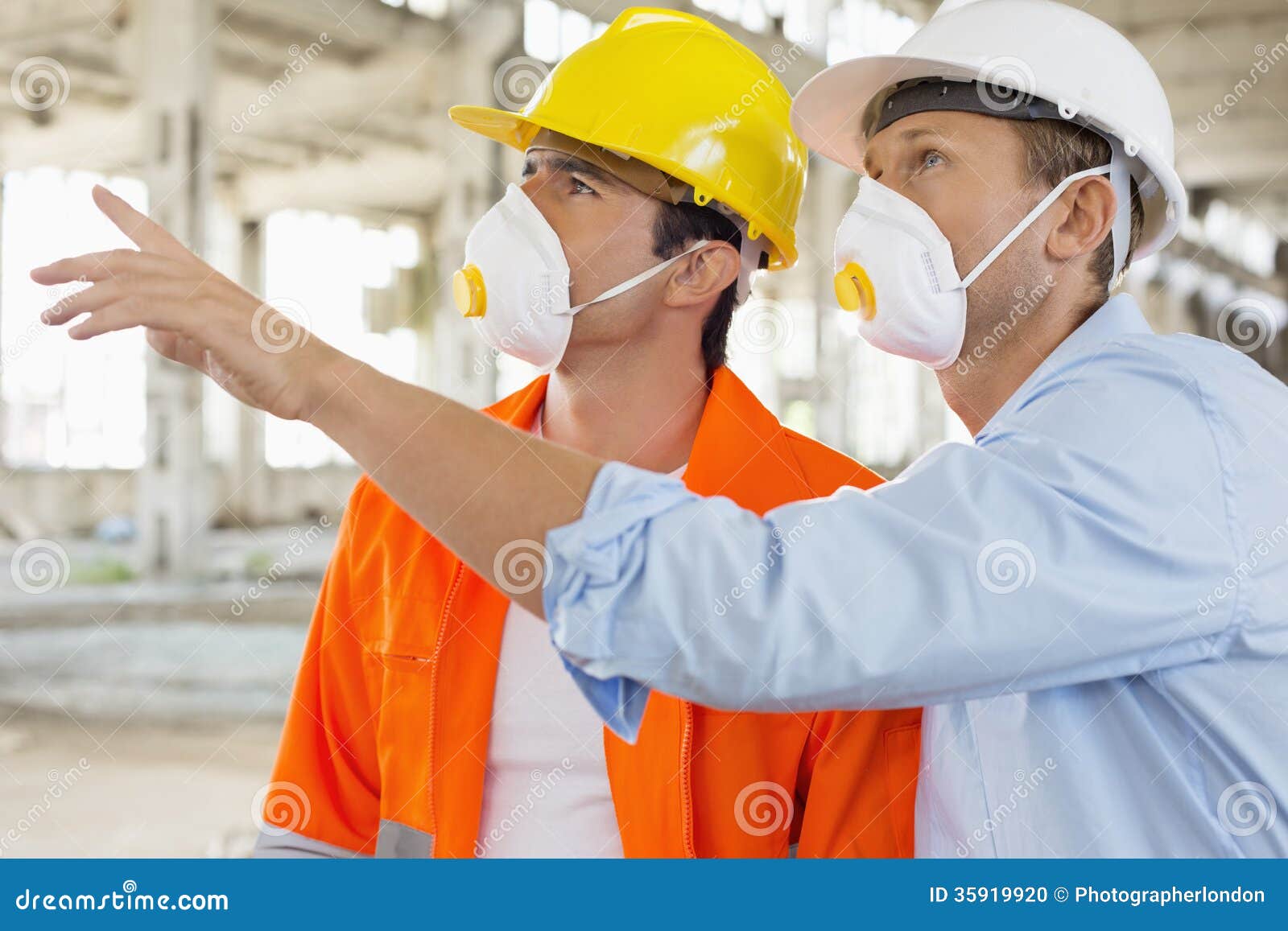 Male Construction Workers Having a Discussion at Site Stock Photo ...