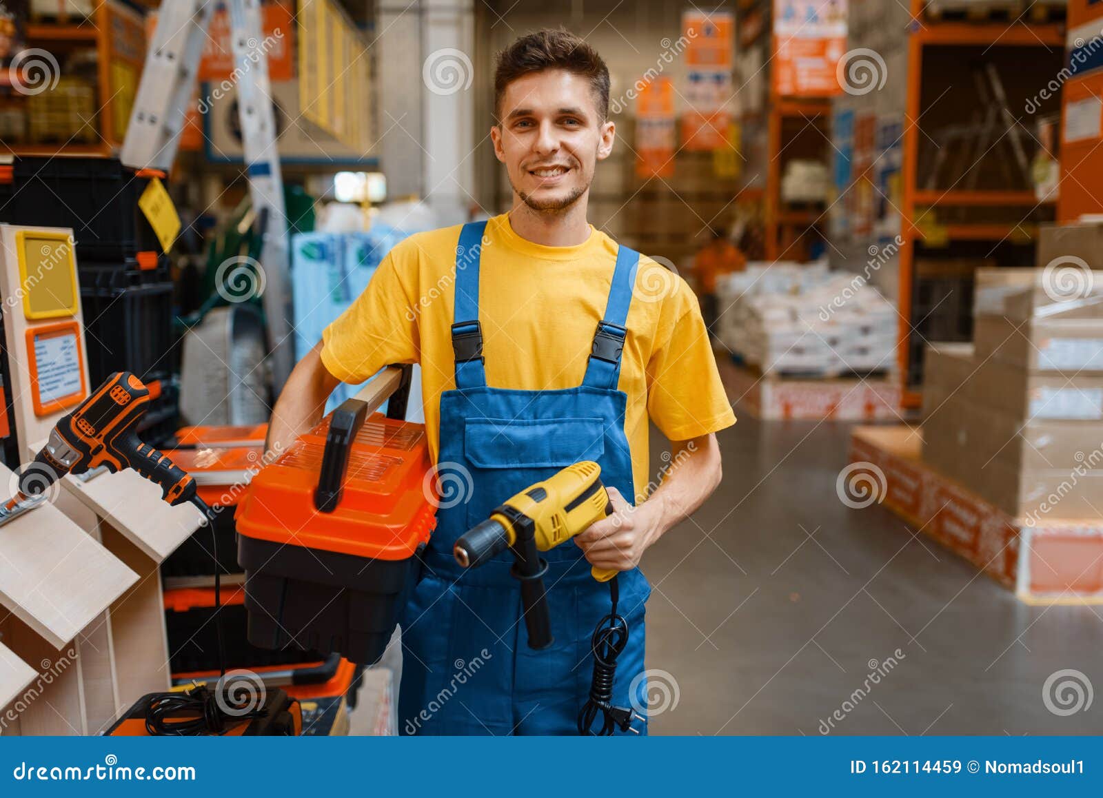 Male Constructor Holds Tools in Hardware Store Stock Image - Image of ...