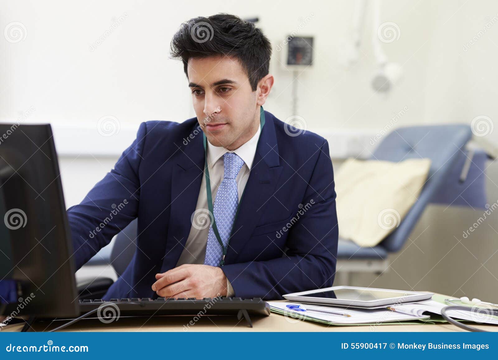Male Consultant Working at Desk in Office Stock Image - Image of ...