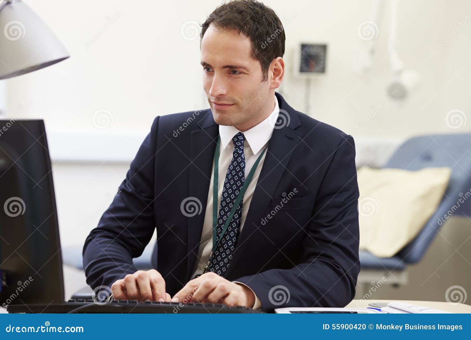 Male Consultant Working at Desk in Office Stock Photo - Image of ...