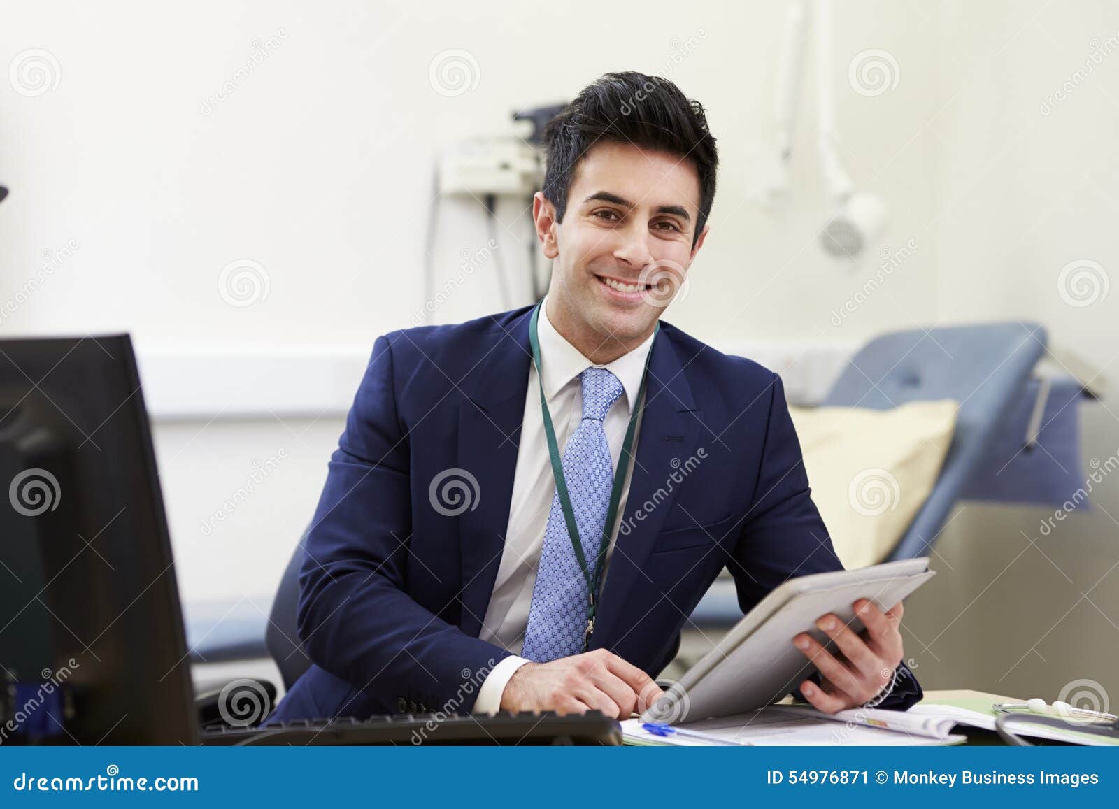 Male Consultant Working at Desk Using Digital Tablet Stock Image ...