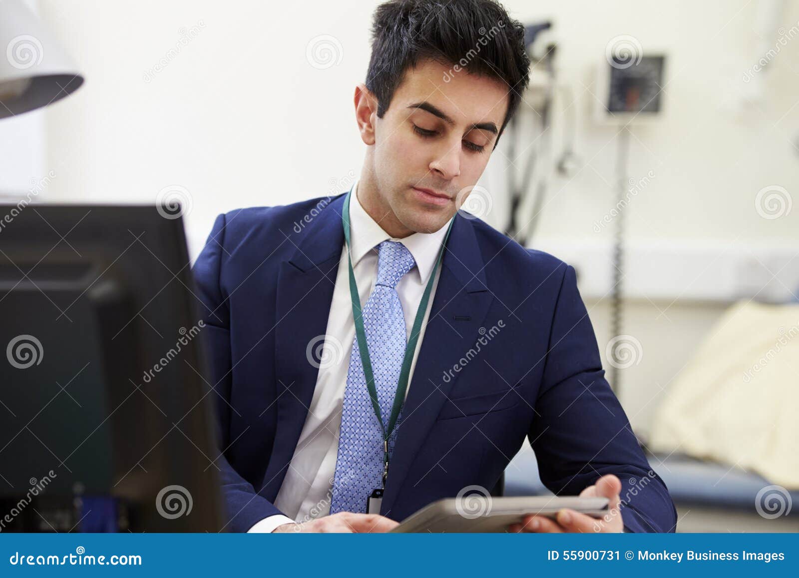 Male Consultant Working at Desk Using Digital Tablet Stock Image ...