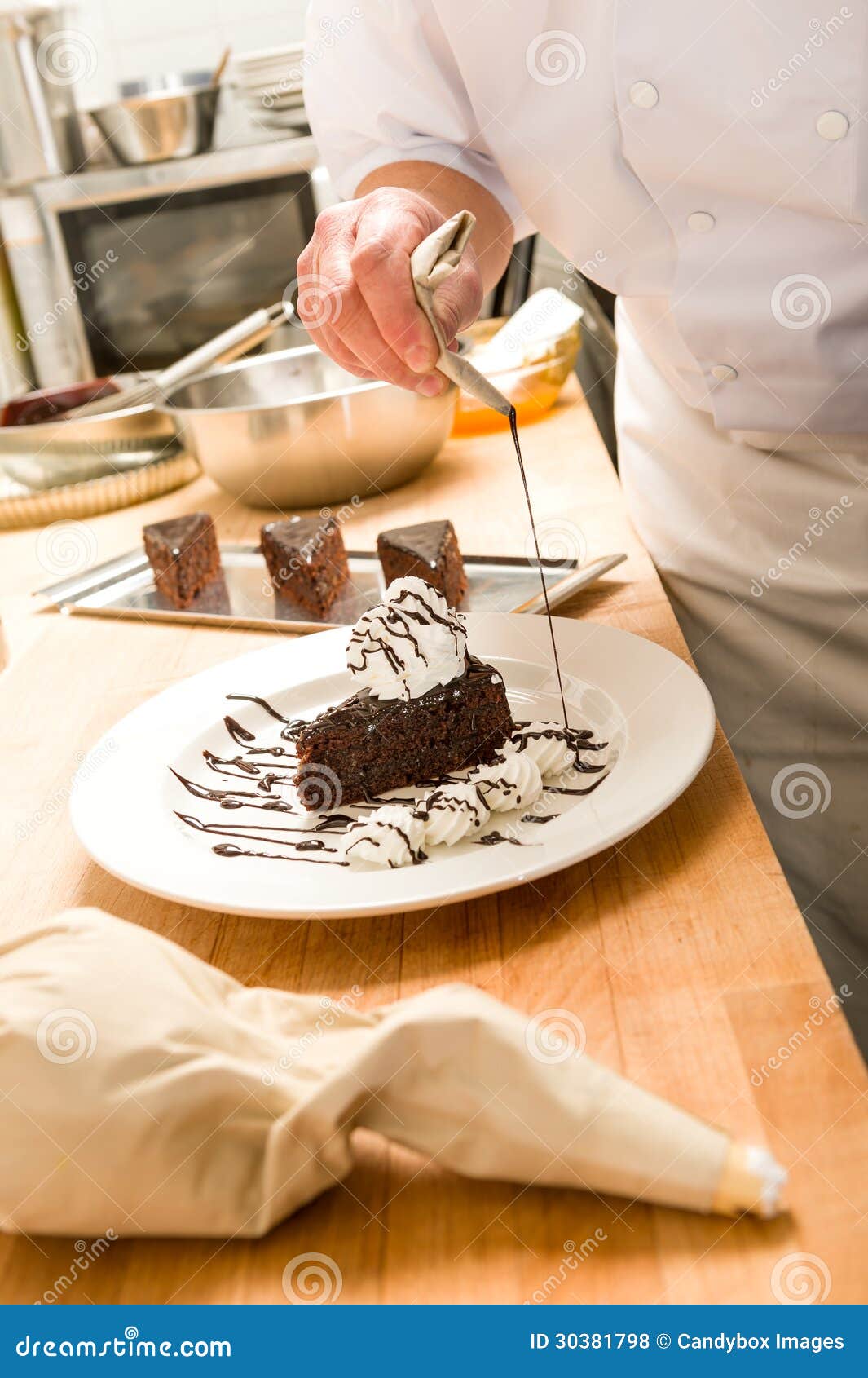 Male Cook Decorating Slice of Chocolate Cake Stock Photo - Image of ...
