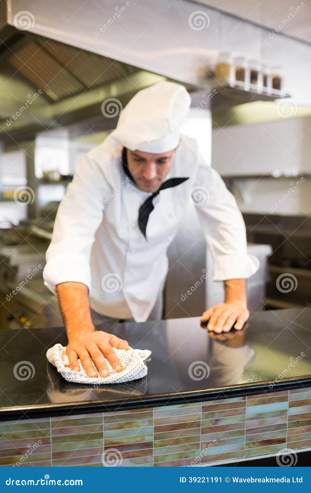 Male Cook Wiping Kitchen Counter Stock Image - Image of chef, indoors ...