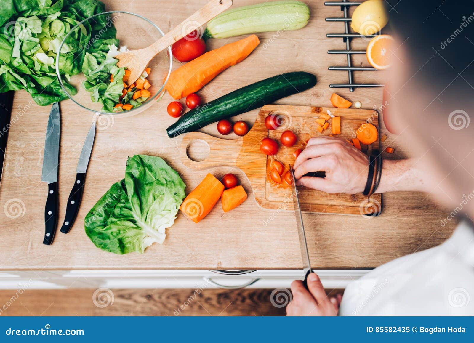 Male Cooking in Kitchen, Cutting Vegetables for Bio Raw Salad. Stock ...