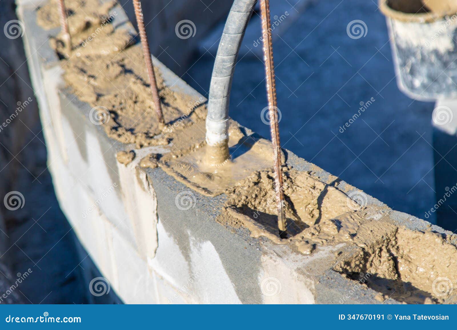 Male Craftsman Pouring Concrete into Concrete Bricks. Selective Focus ...