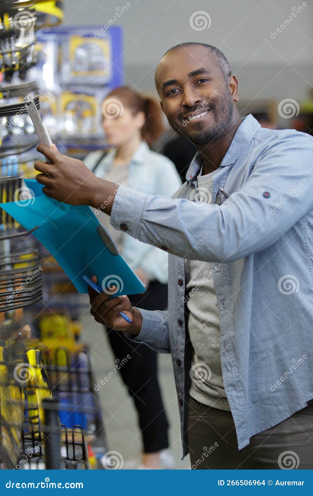 Male Customer in Hardware Store Selecting Products Stock Photo - Image ...