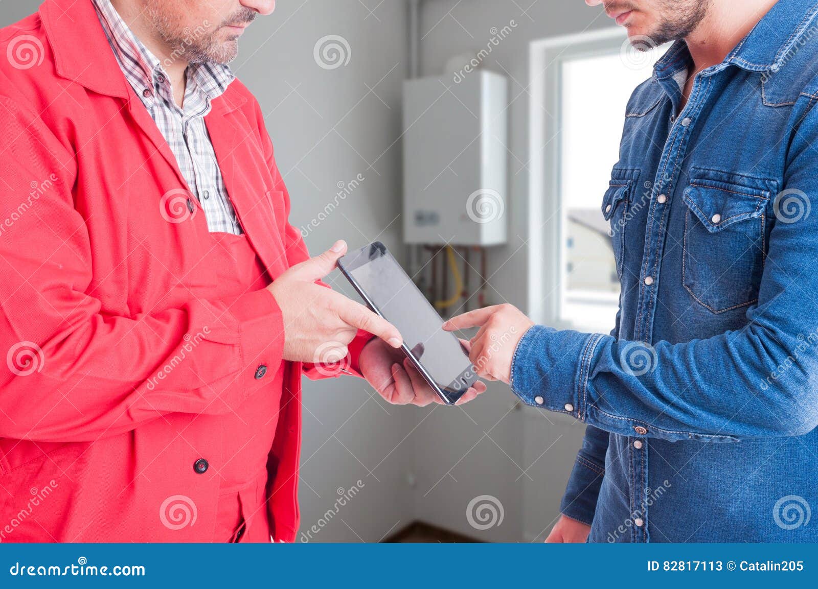 Male Customer with Plumber Browsing on Tablet Stock Image - Image of ...