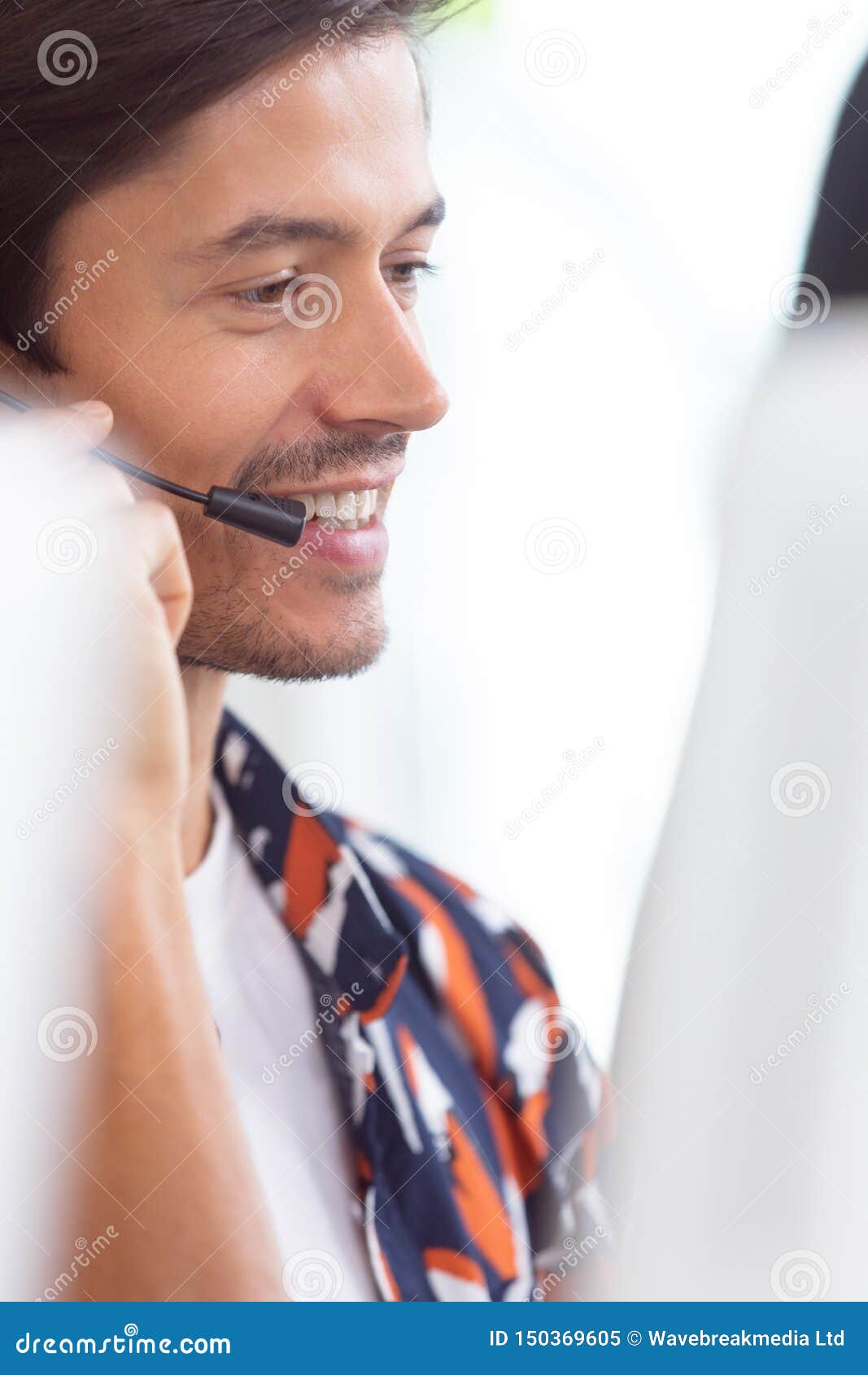 Male Customer Service Executive Working on Computer at Desk Stock Image ...