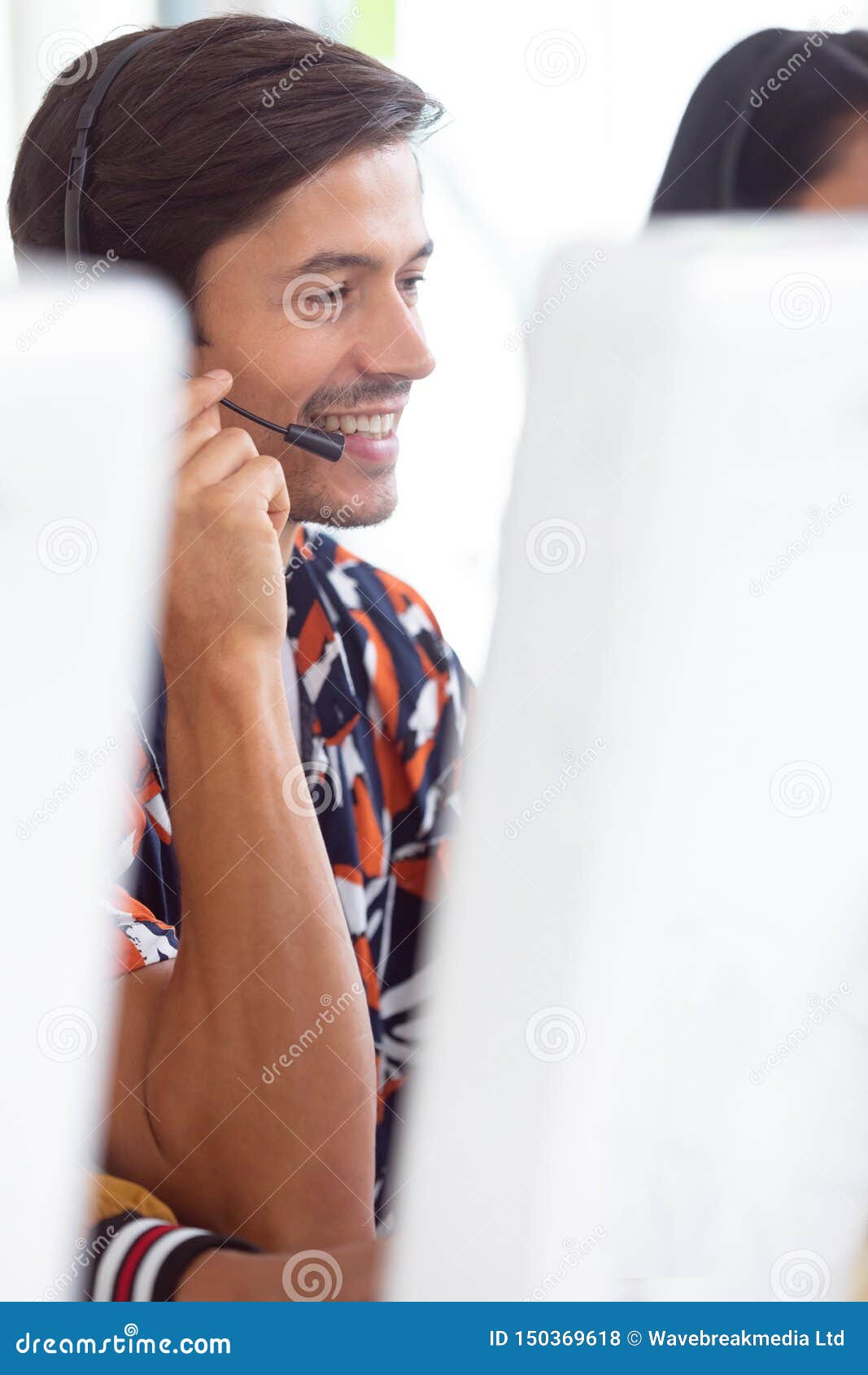 Male Customer Service Executive Working on Computer at Desk Stock Photo ...