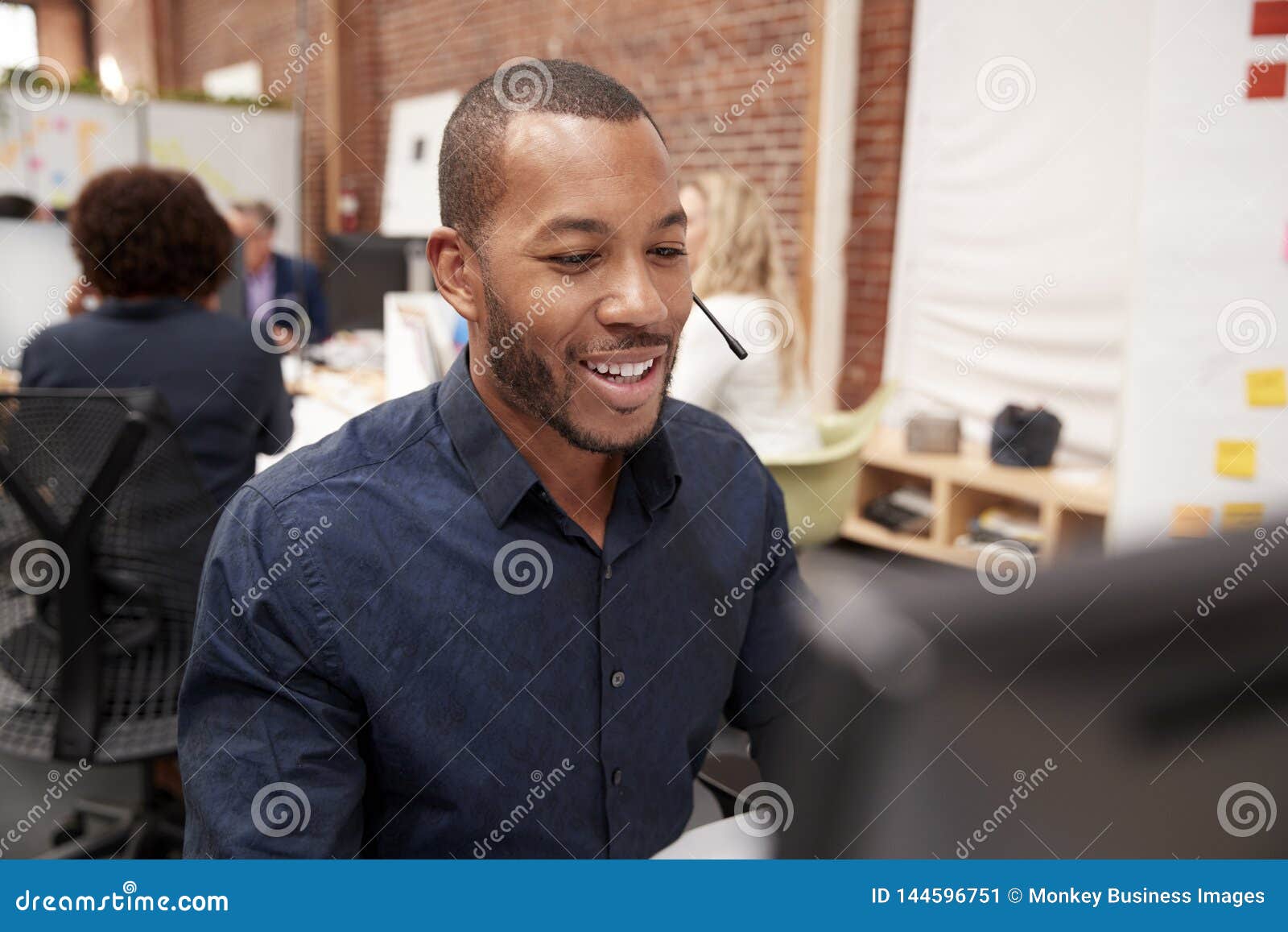 Male Customer Services Agent Working at Desk in Call Center Stock Image ... Male Customer Services Agent Working at Desk in Call Center Stock Image ...