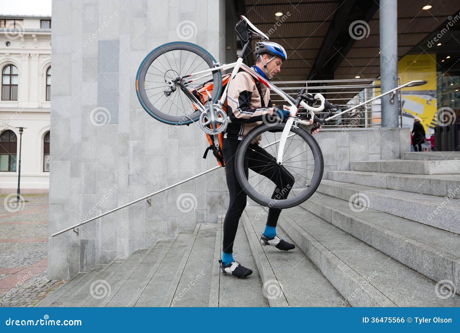 Male Cyclist with Bicycle on His Shoulder Walking Stock Photo - Image ...
