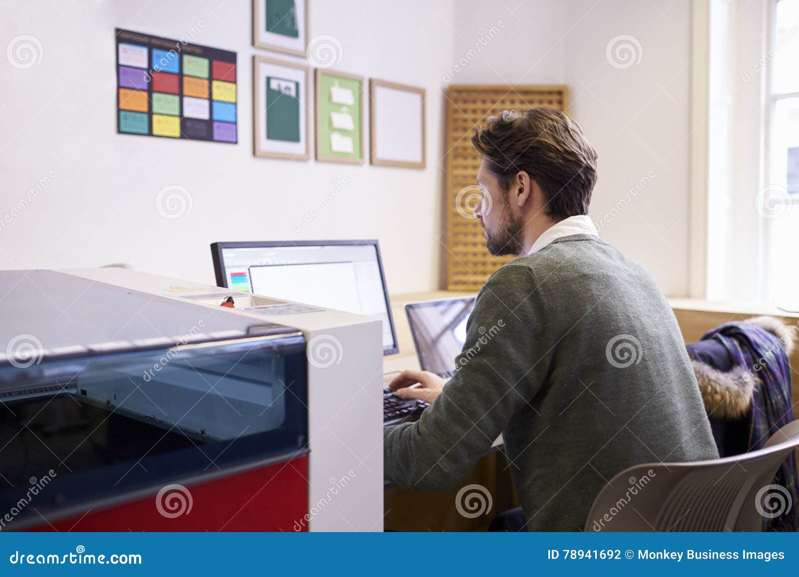 Male Designer Operating CAD System for Laser Cutter Stock Photo - Image ...