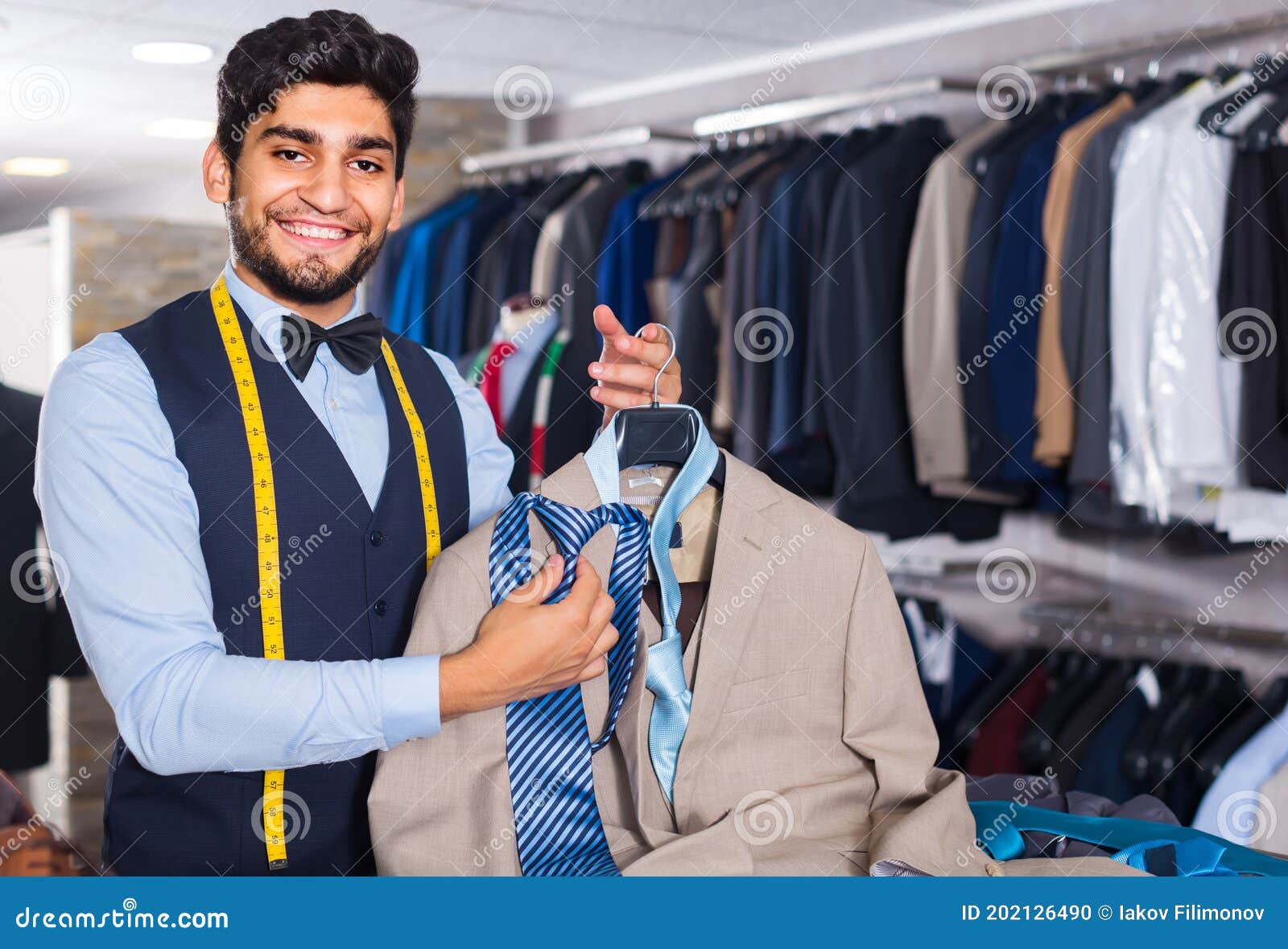Male Designer is Picking Up a Tie for Light Jacket Stock Photo - Image ...