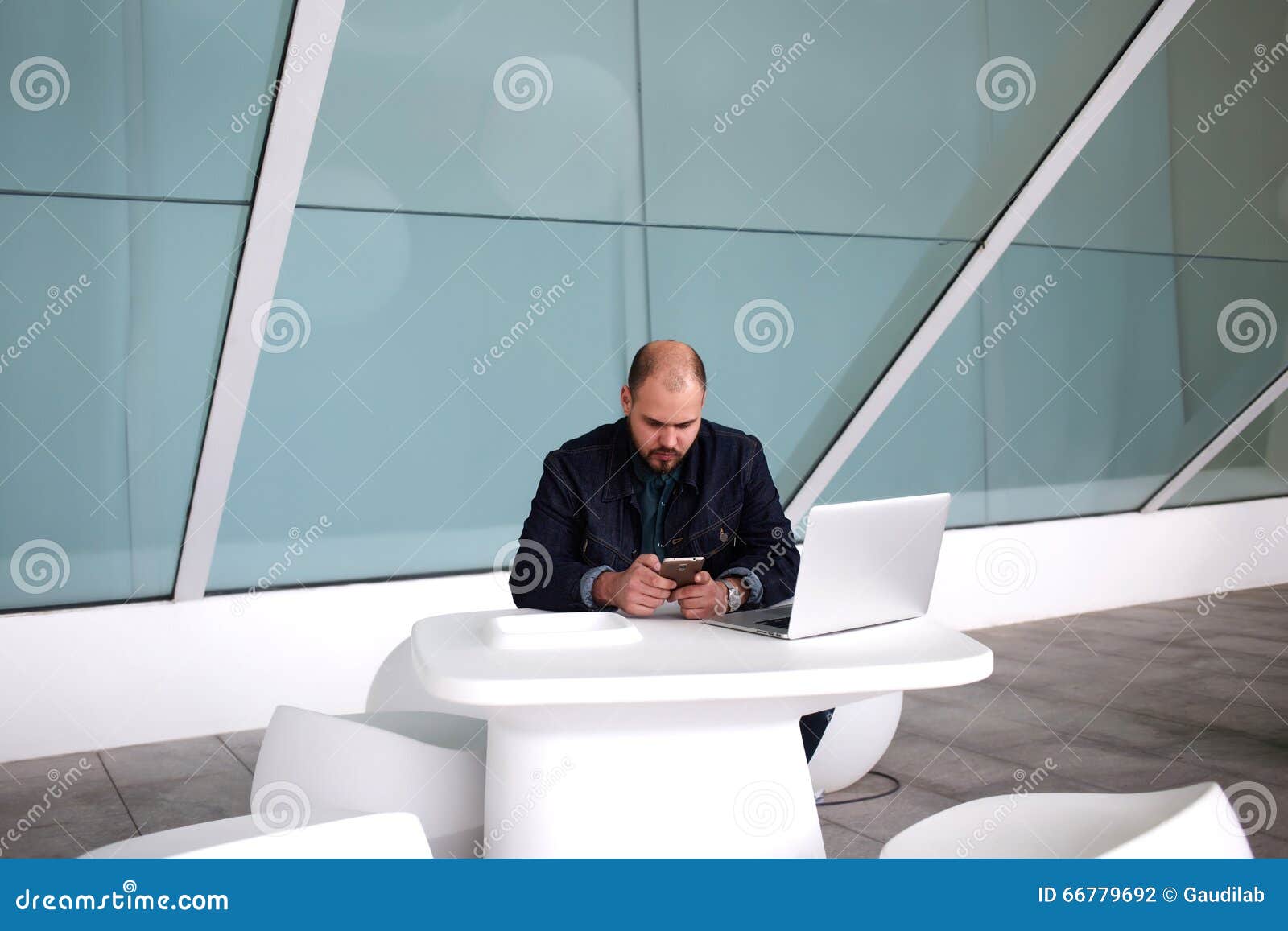 Male Developer Chatting on Mobile Phone after Work on Laptop Computer ...