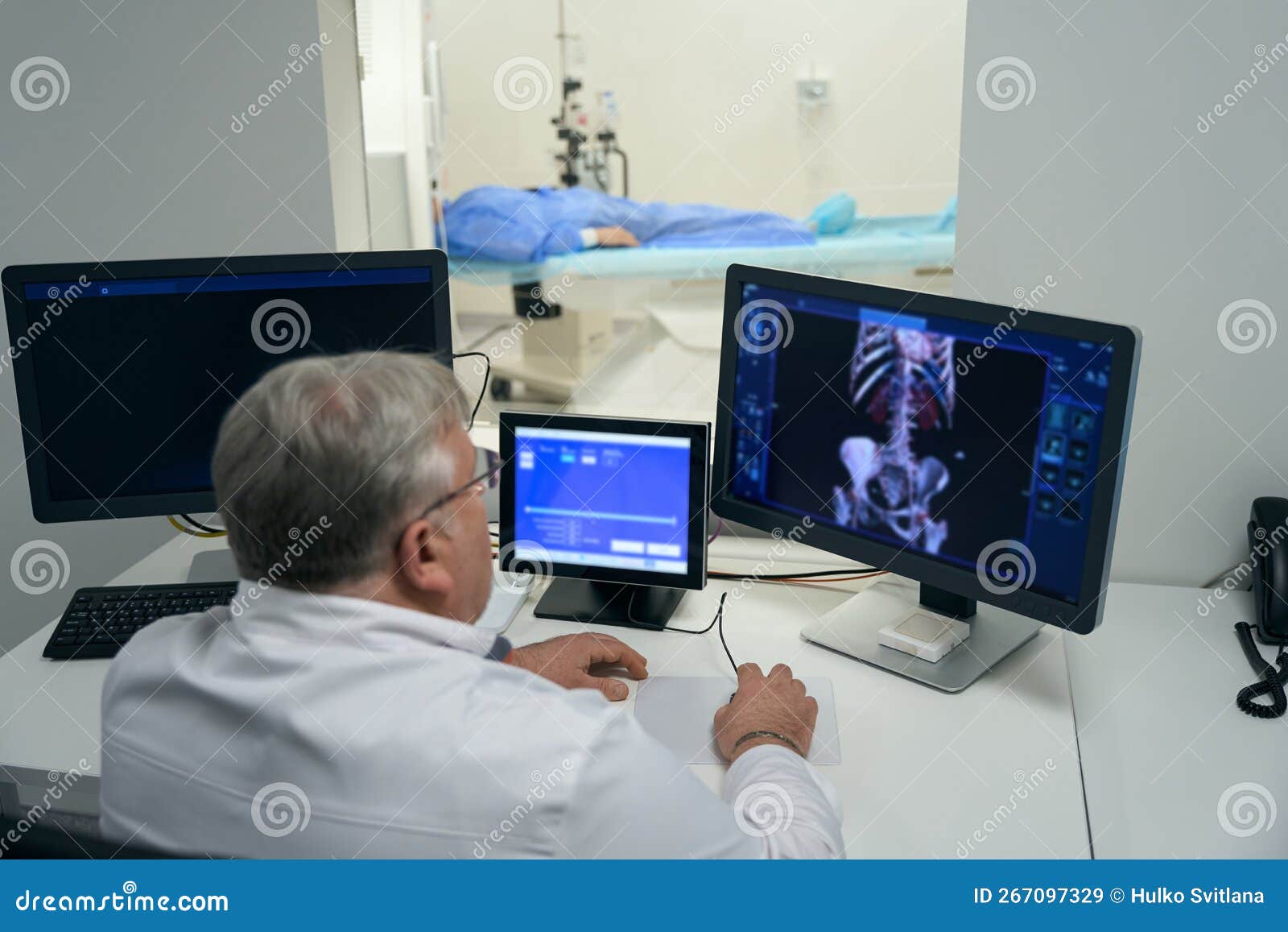 Male Diagnostician Performs a CT Scan Using Modern Equipment Stock ...
