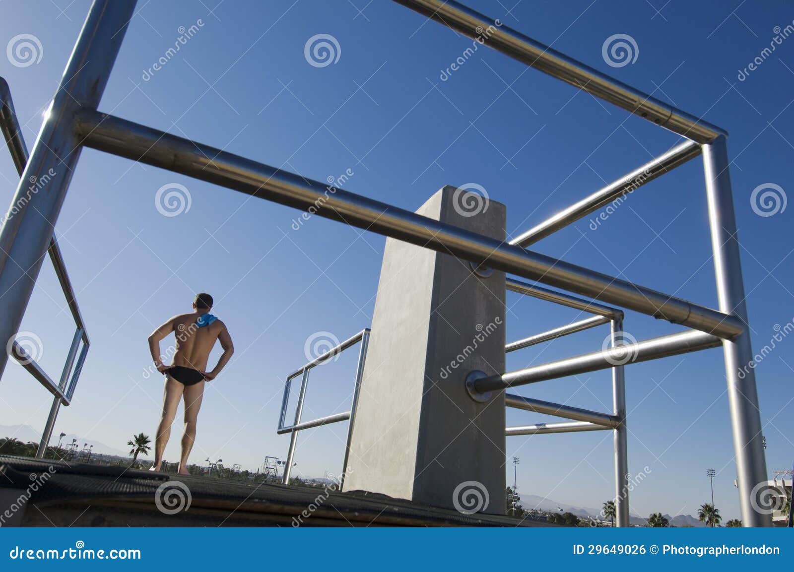 Male Diver Standing on the Springboard Stock Photo - Image of pool ...