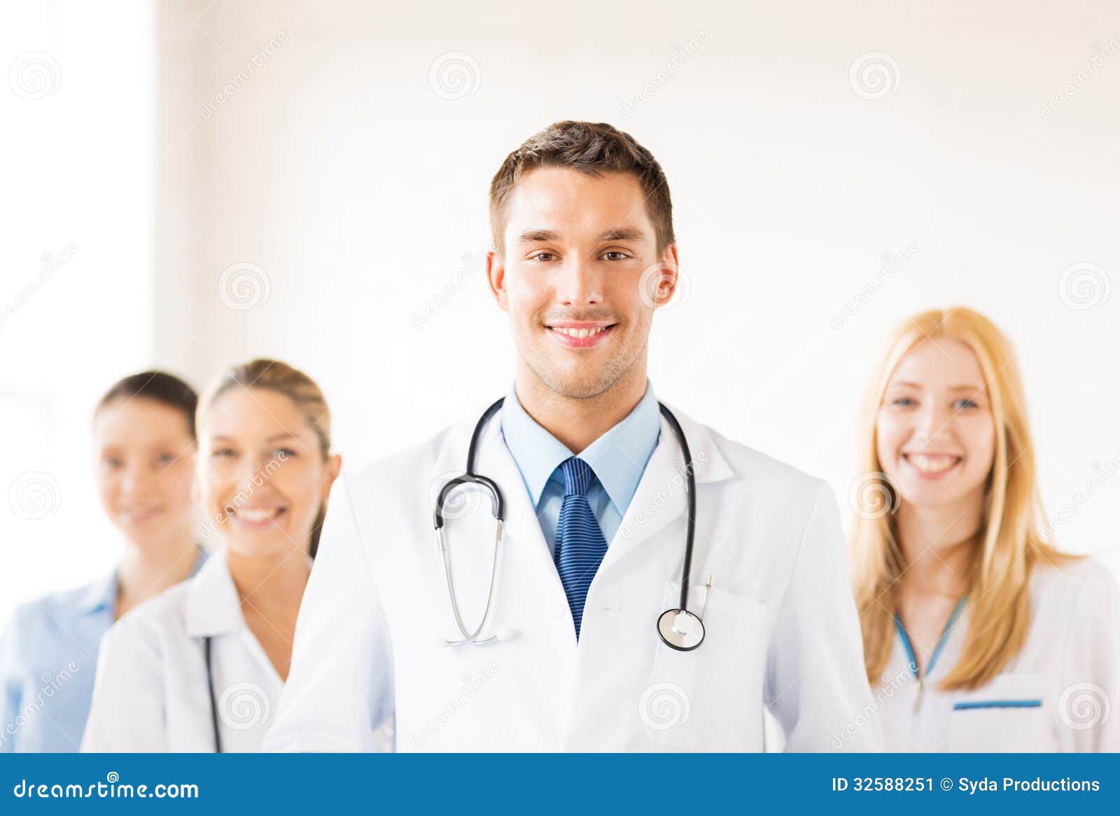 Male Doctor in Front of Medical Group Stock Image - Image of blue ...