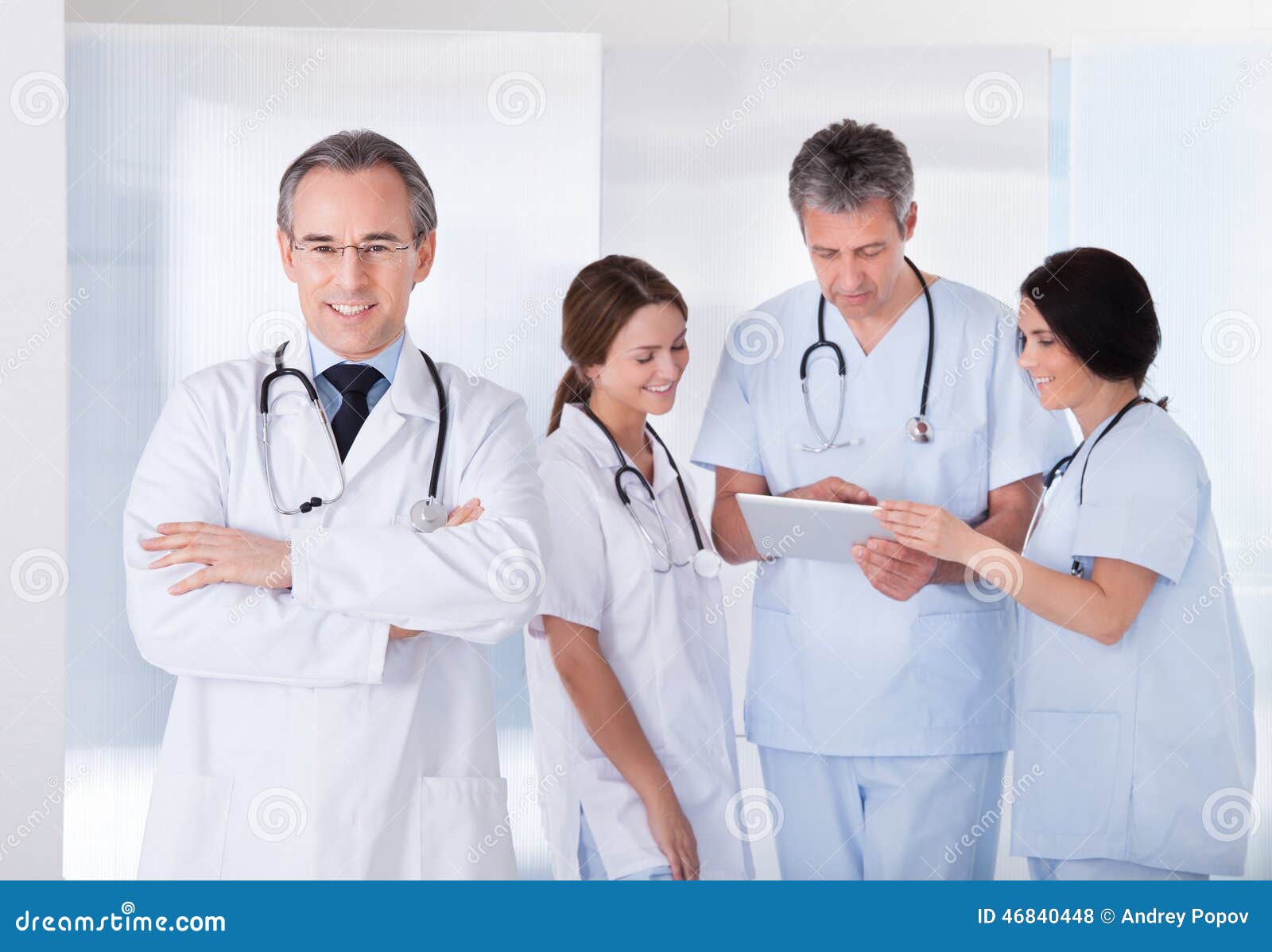Male Doctor in Front of Team Stock Photo - Image of digital, assistance ...