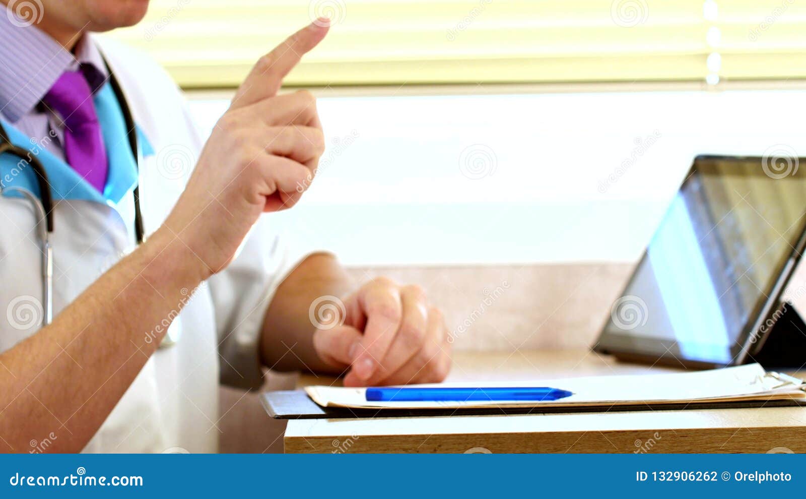 Male Doctor Gesturing and Explaining Something for Patient. Stock Photo ...