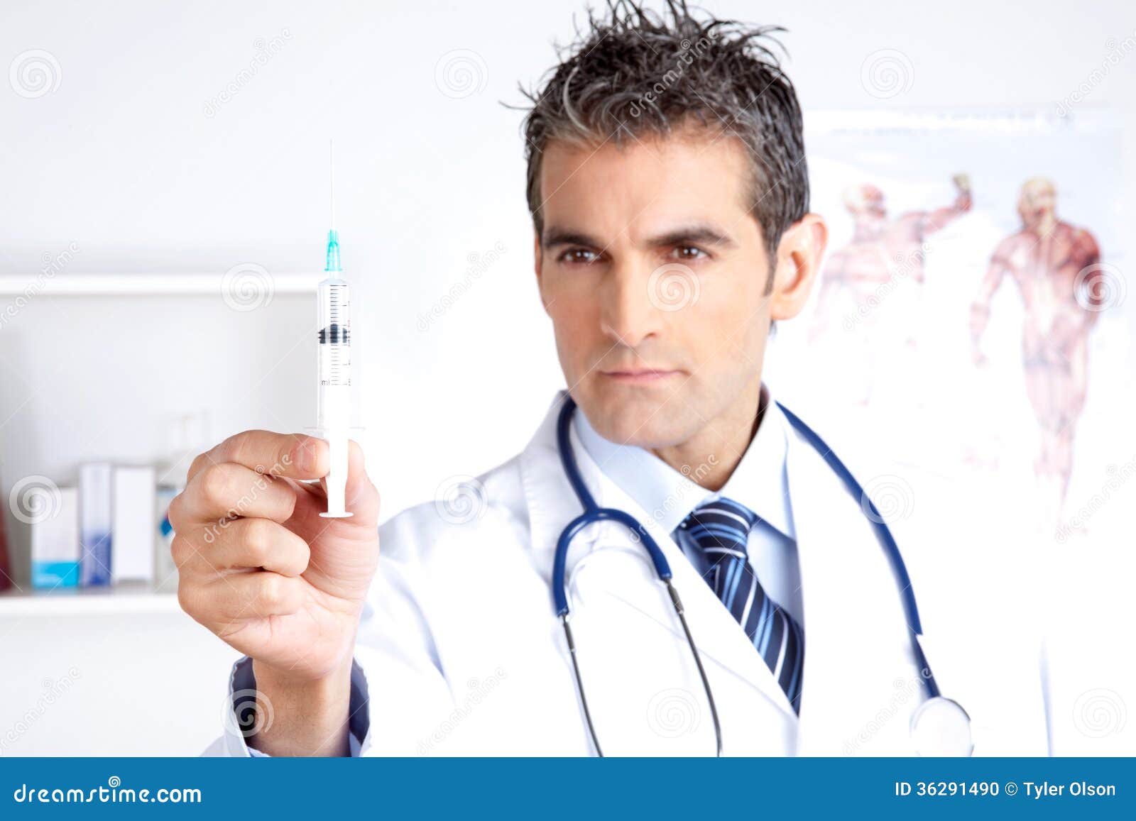 Male Doctor Looking at Syringe Stock Photo - Image of physician ...