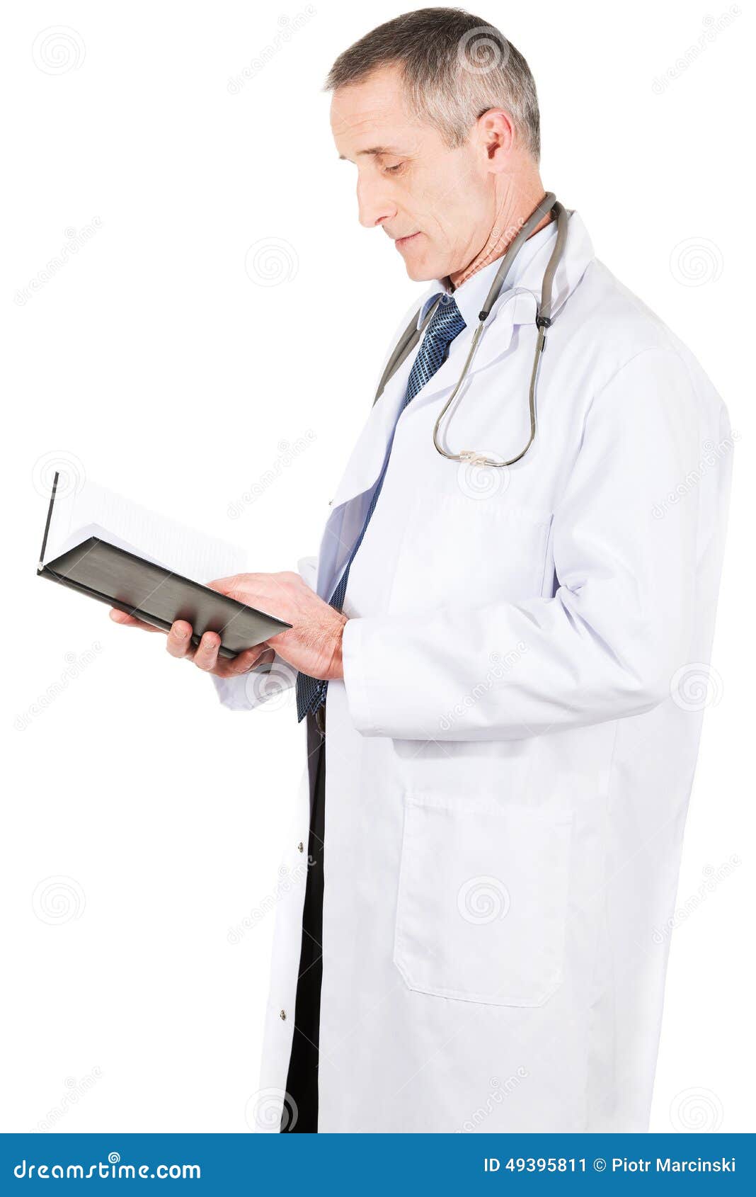 Male doctor reading notes stock image. Image of medical - 49395811