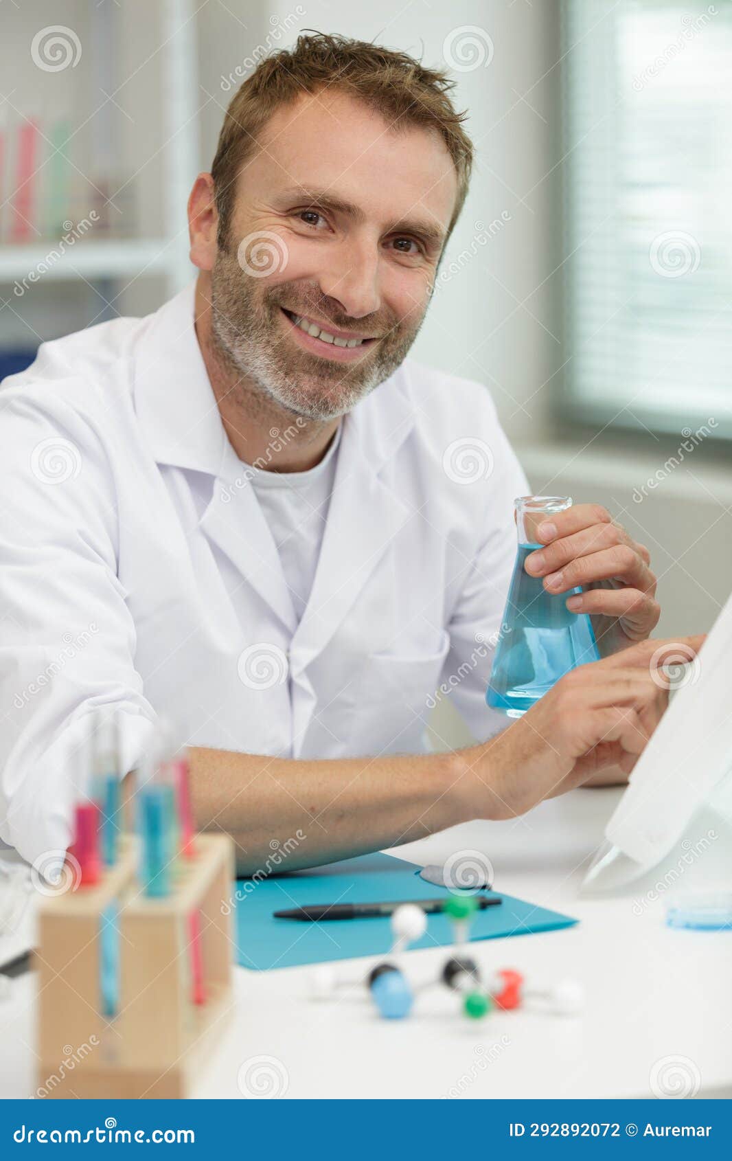 Male Doctor Smiles at Camera in Lab Stock Photo - Image of student ...