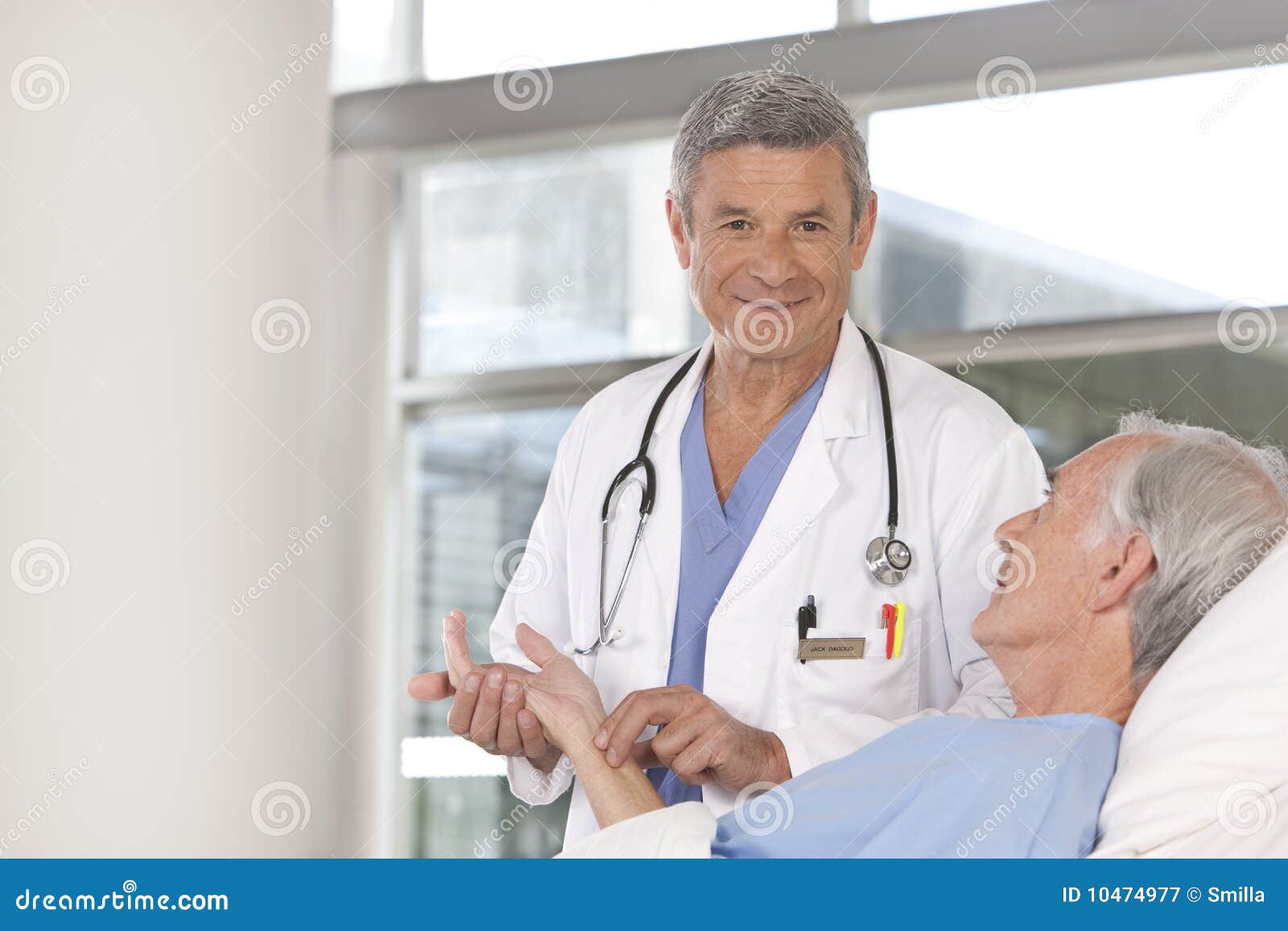 Male Doctor Taking Care of Patient Stock Image - Image of portrait ...