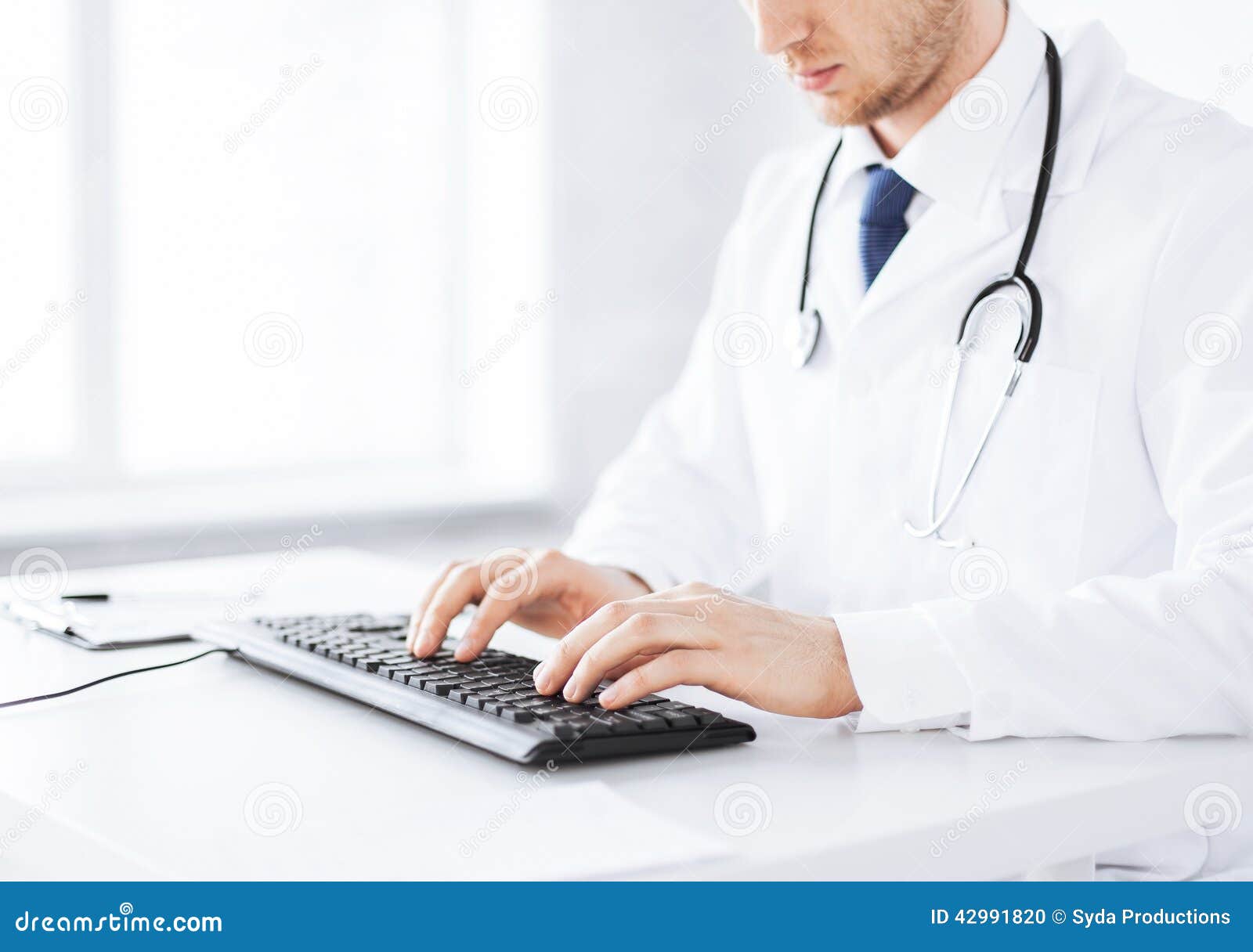 Male Doctor Typing on the Keyboard Stock Photo - Image of high, cabinet ...