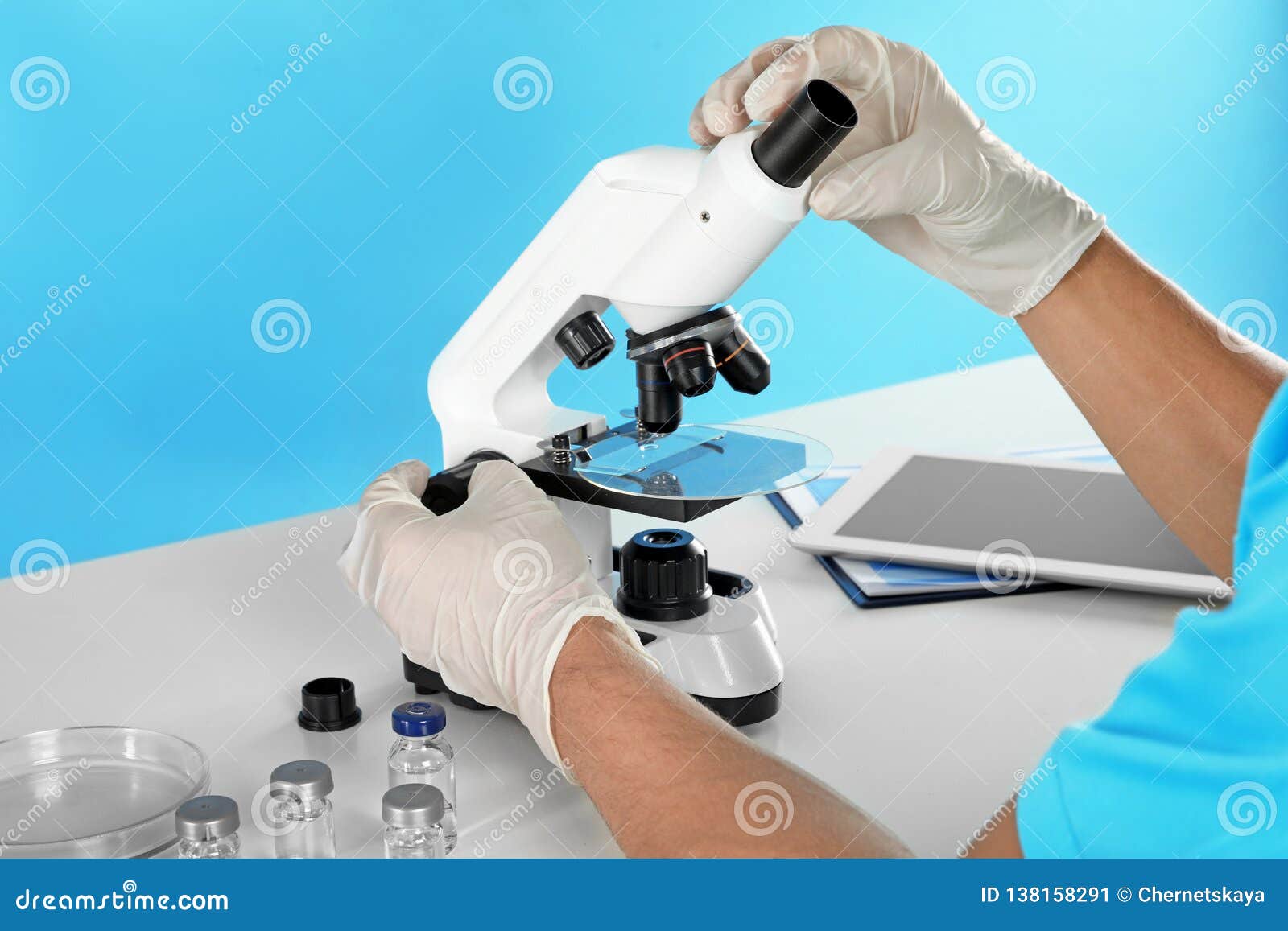 Male Doctor Using Microscope at Table. Medical Object Stock Image ...